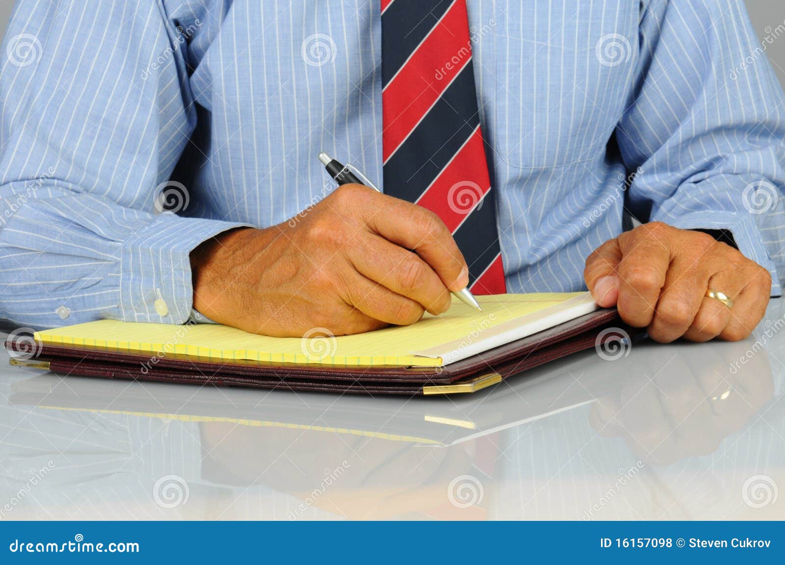 Businessman Writing in Note Pad Stock Photo - Image of male, closeup ...