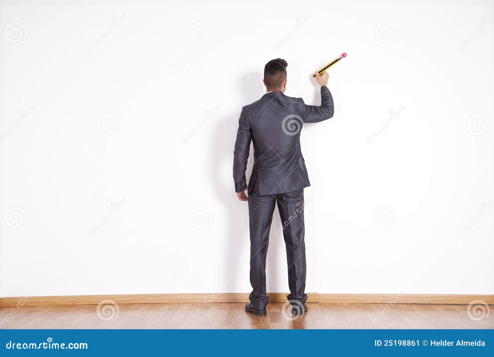 Businessman Writing at the Office Wall Stock Image - Image of empty ...