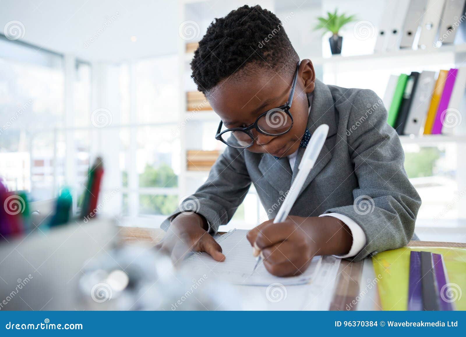 Businessman Writing on Paper at Desk Stock Photo - Image of holding ...