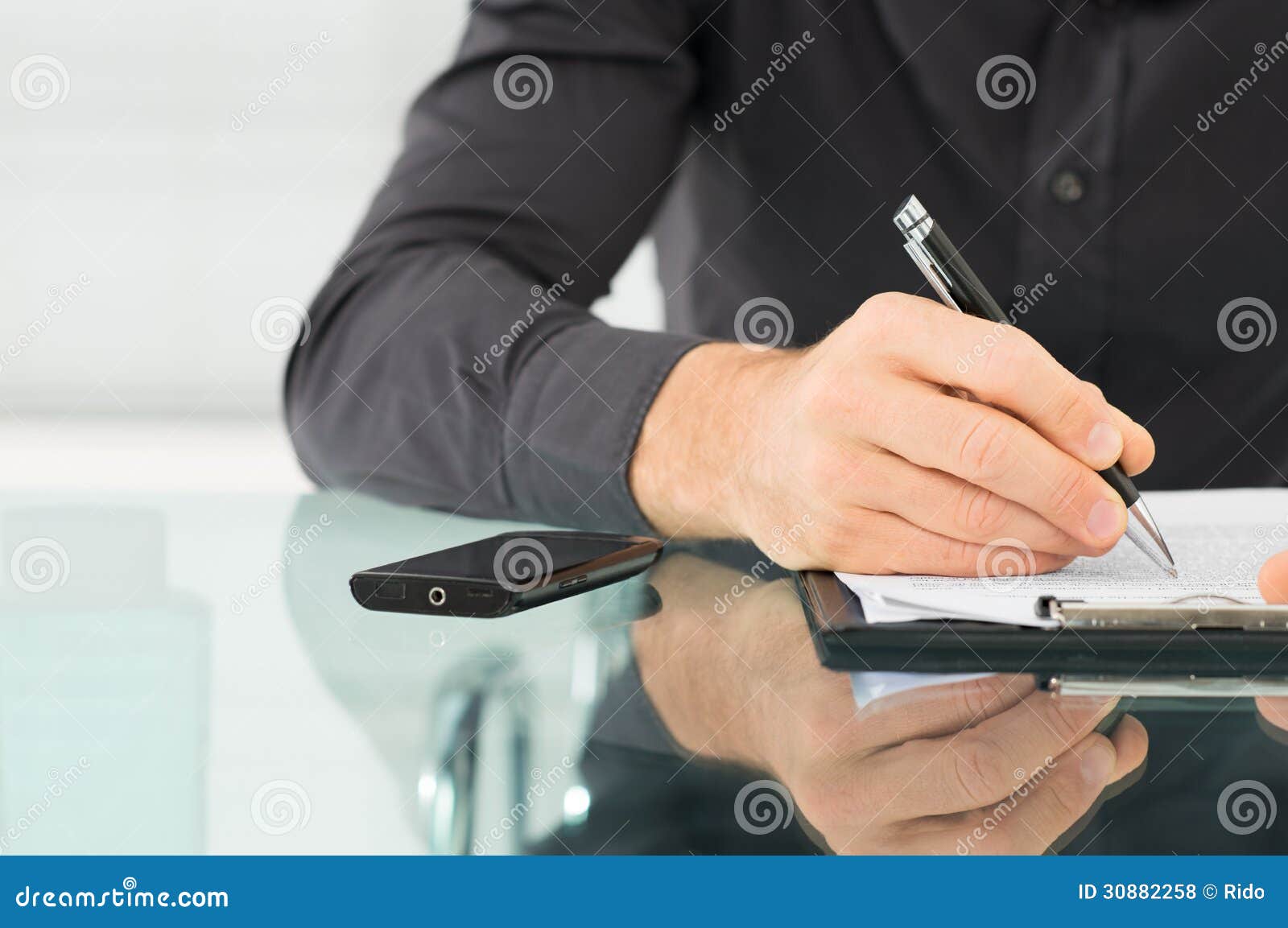 Businessman Writing a Paperwork Stock Photo - Image of copyspace, busy ...