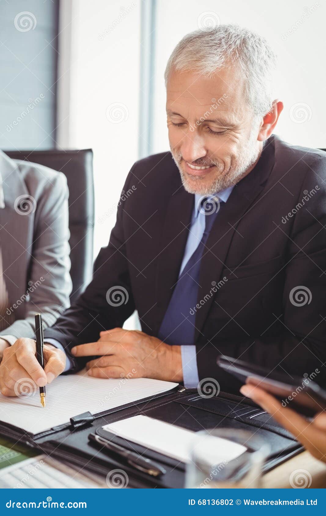 Businessman Writing a Report in Conference Room Stock Photo - Image of ...
