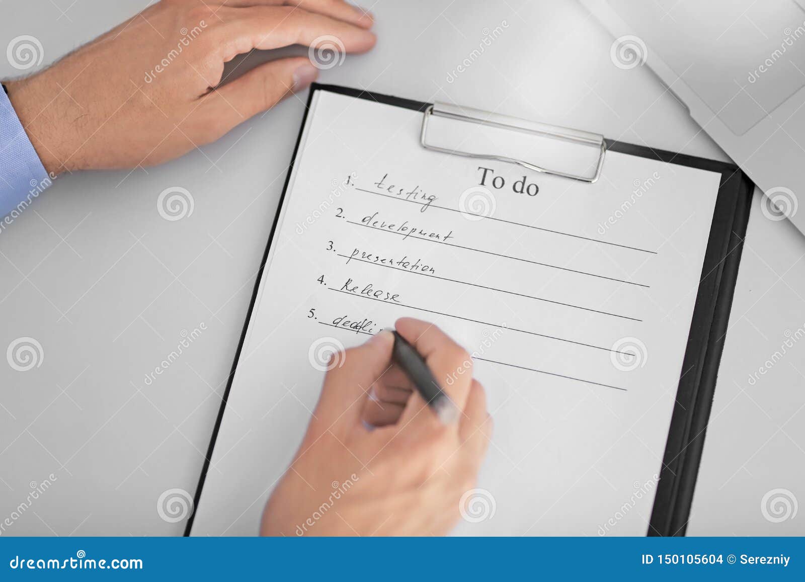 Businessman Writing To-do List at Table in Office Stock Photo - Image ...