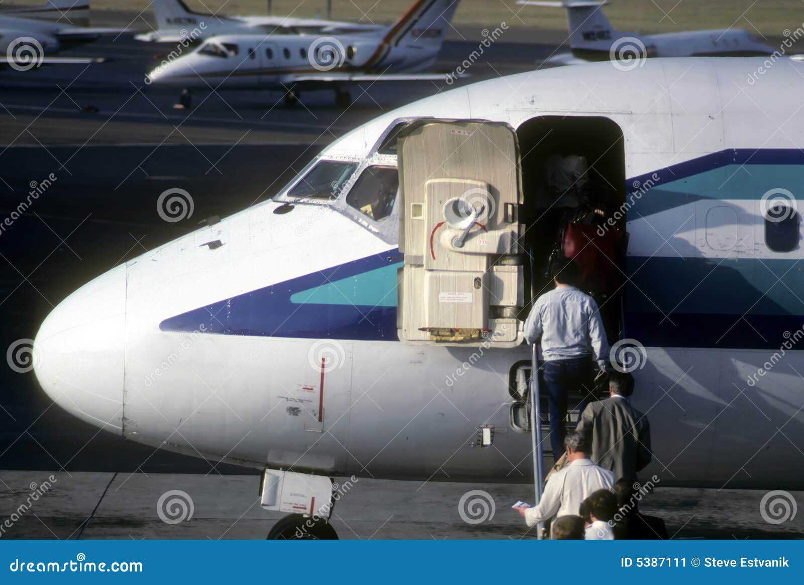 Businessmen Boarding Commuter Jet Stock Image - Image of travelers ...