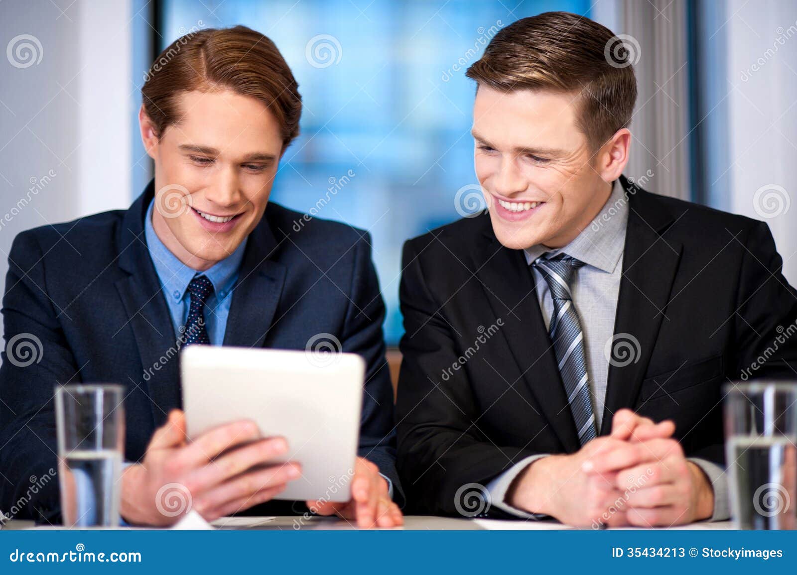 Businessmen Browsing on Tablet Device Stock Image - Image of colleagues ...