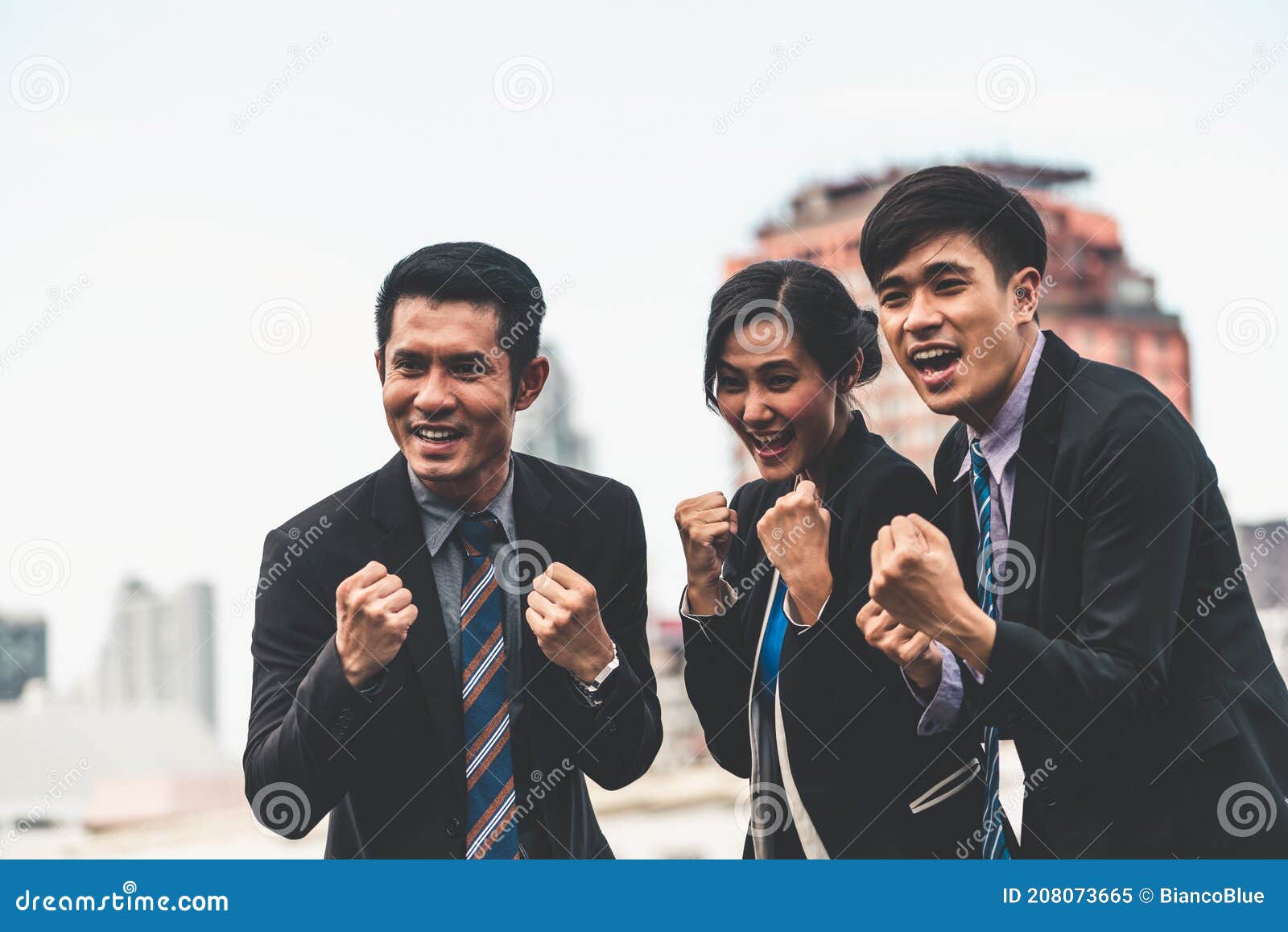 Businessmen And Businesswoman Celebrate Success Stock Image Image Of