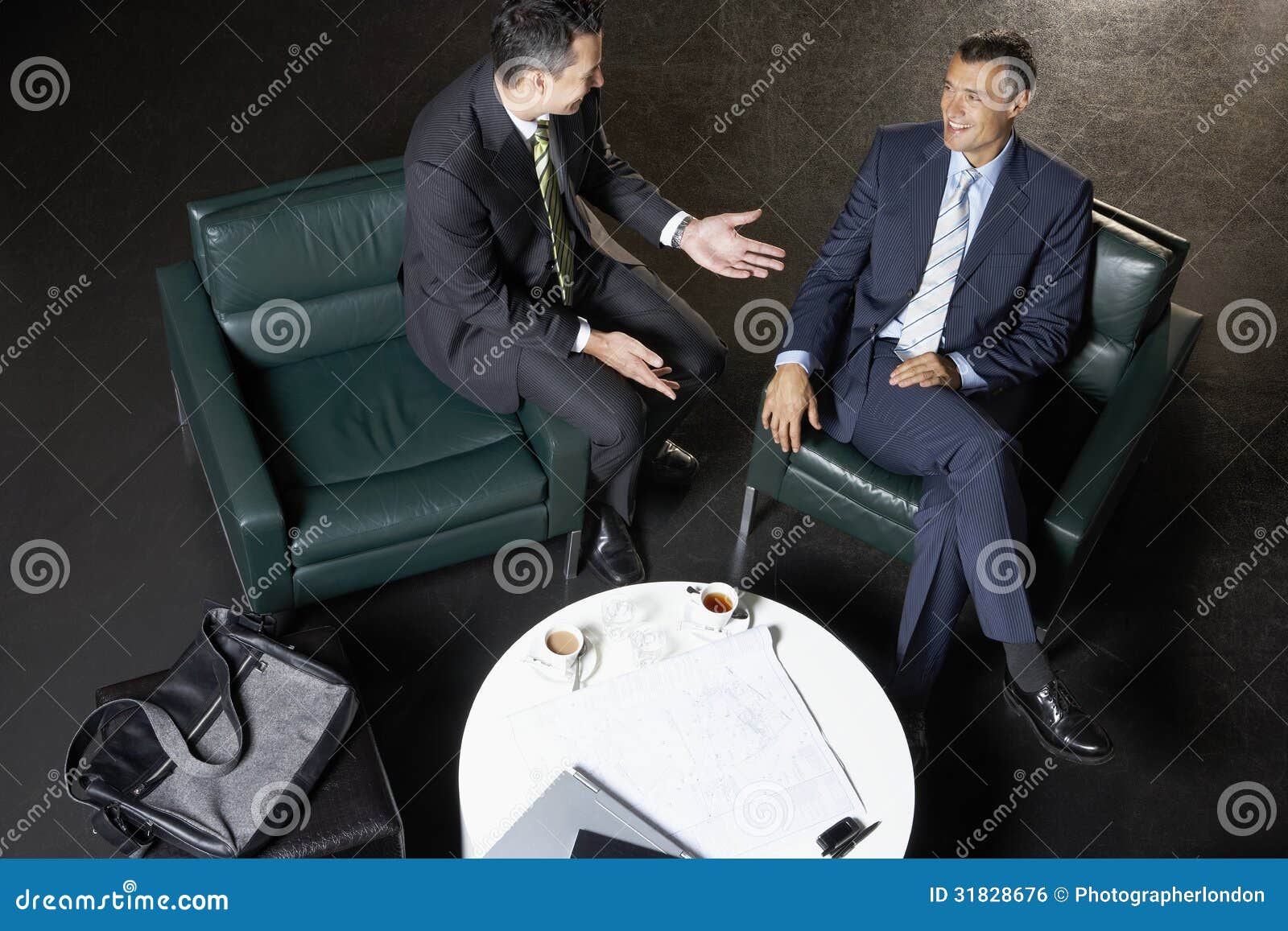 Businessmen Discussing at Coffee Table Stock Photo - Image of ...
