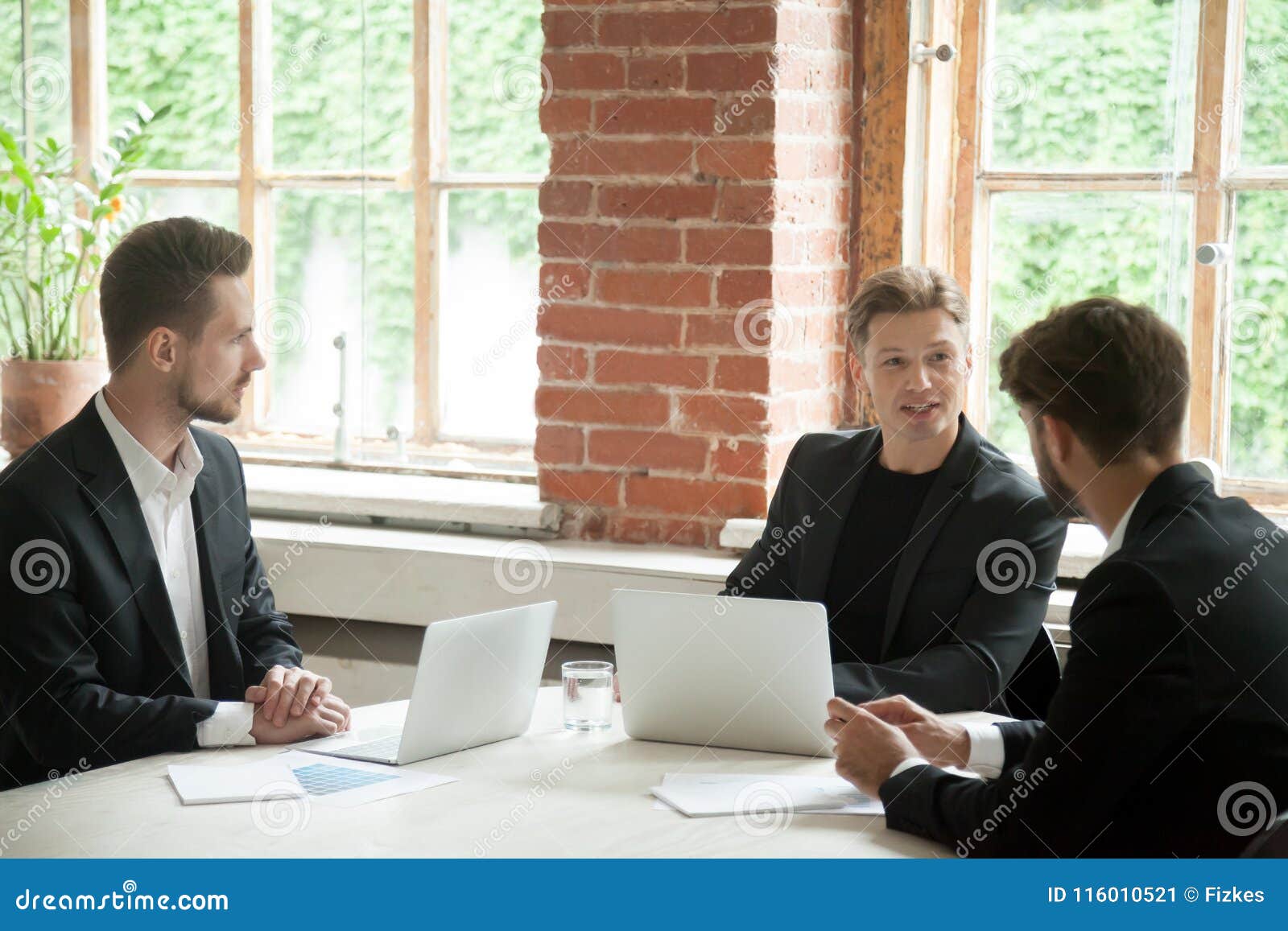 Businessmen Discussing Company Investment with Potential Partner Stock ... Businessmen Discussing Company Investment with Potential Partner Stock ...