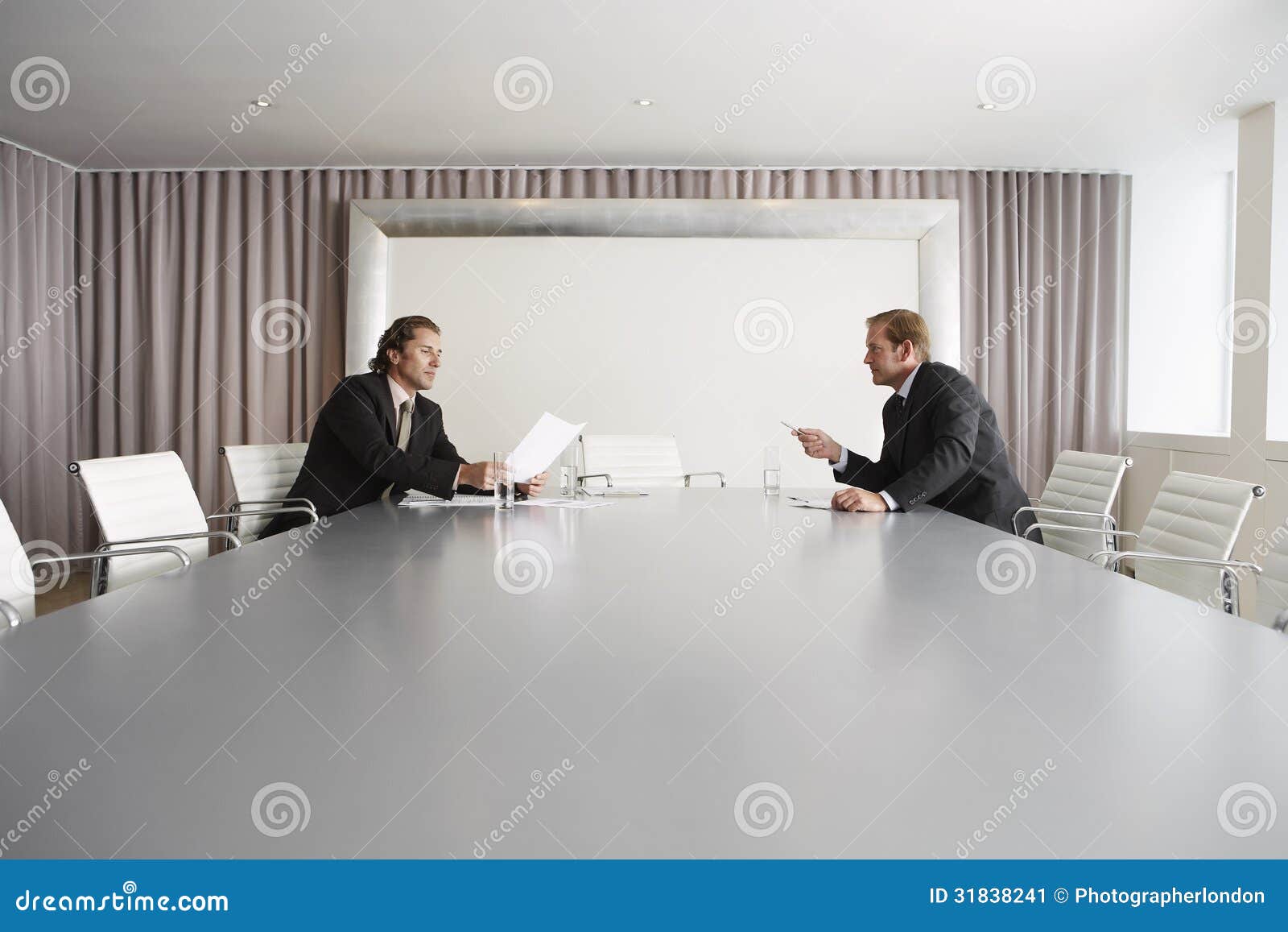 Businessmen Discussing in Conference Room Stock Image - Image of ...