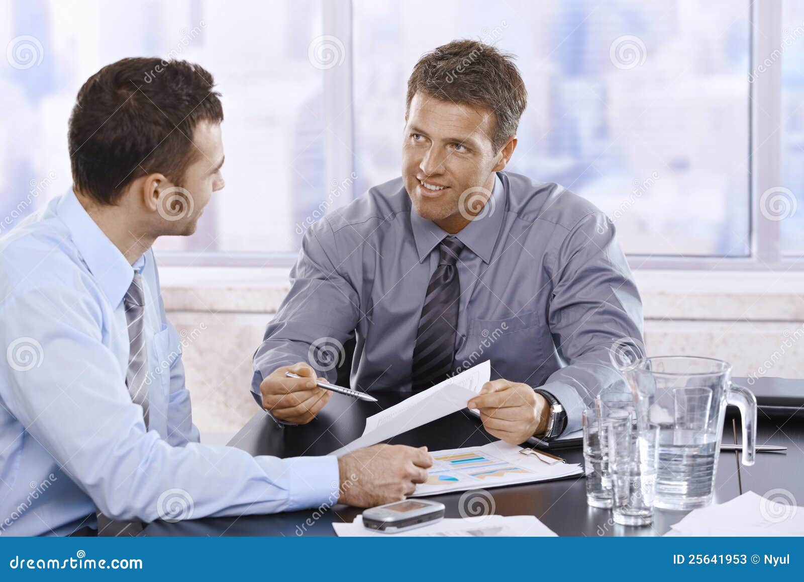 Businessmen Discussing Report Stock Image - Image of discussing ...