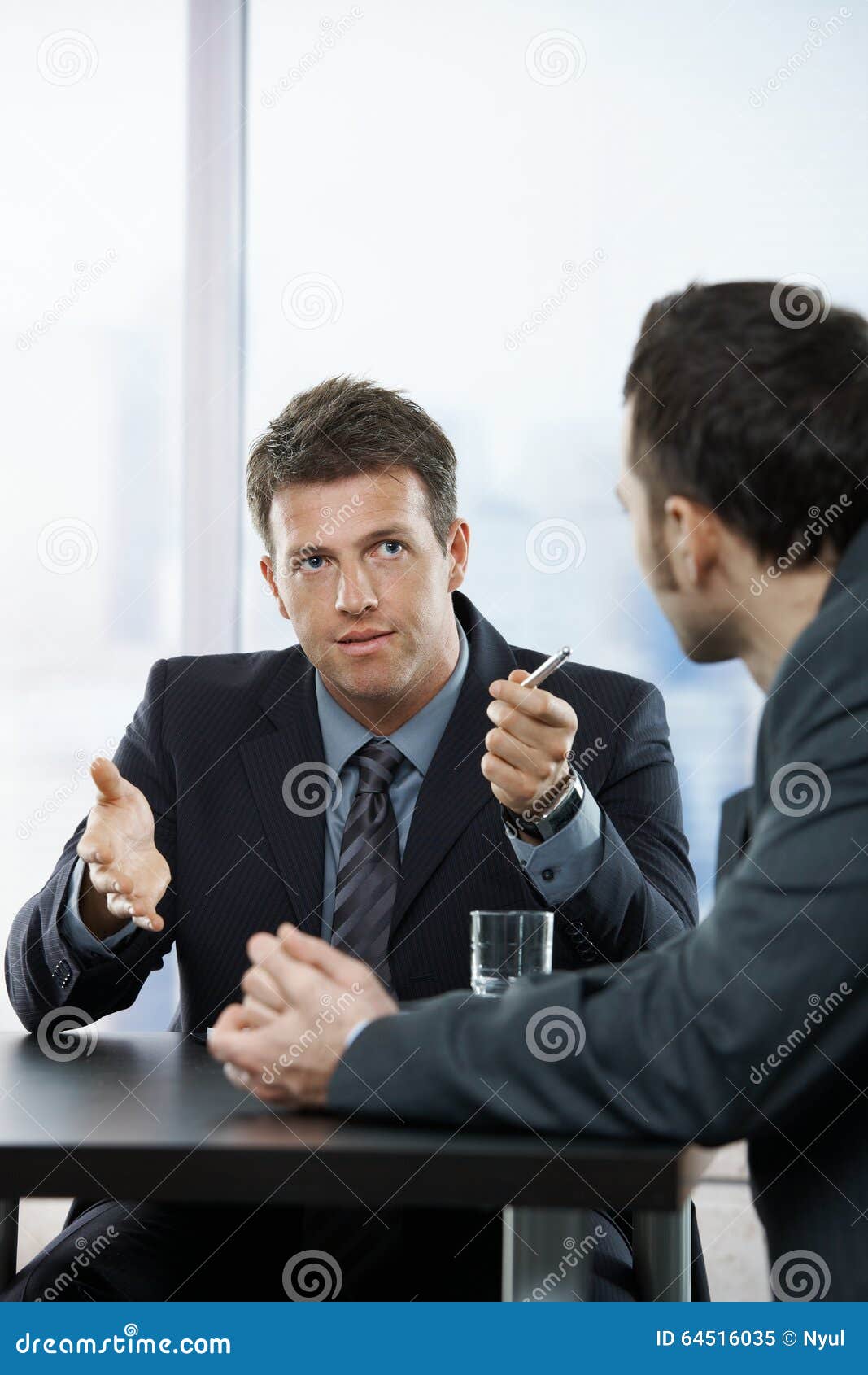 Businessmen at discussion stock image. Image of conference - 64516035