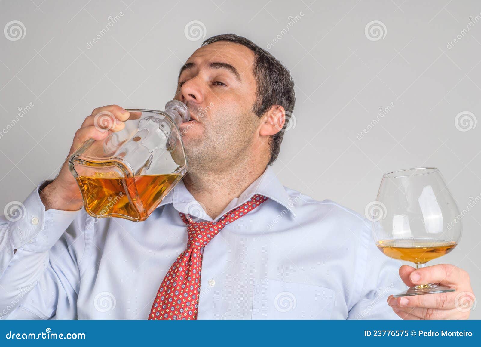 Businessmen Drinking Whiskey Stock Image - Image of bottle, hold: 23776575