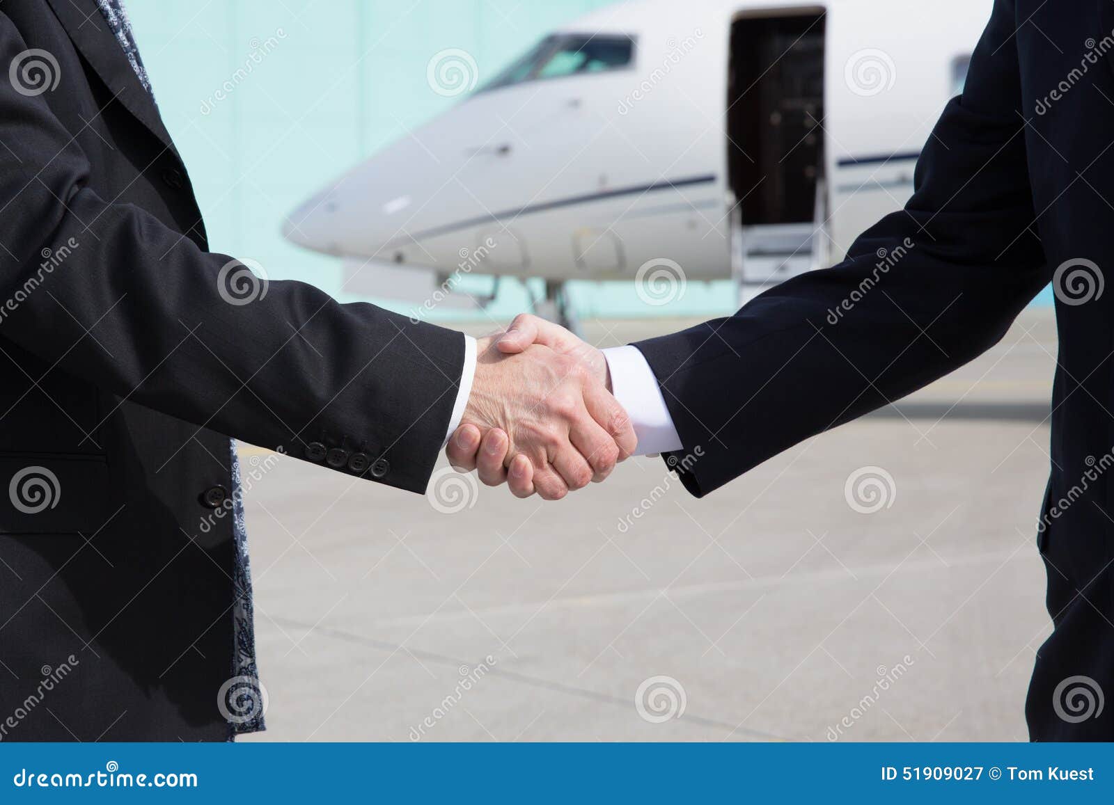 Businessmen Handshake in Front of a Corporate Jet Stock Image - Image ...