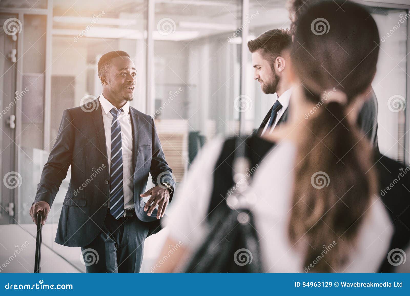 Businessmen Having Conversation while Standing Stock Image - Image of ...