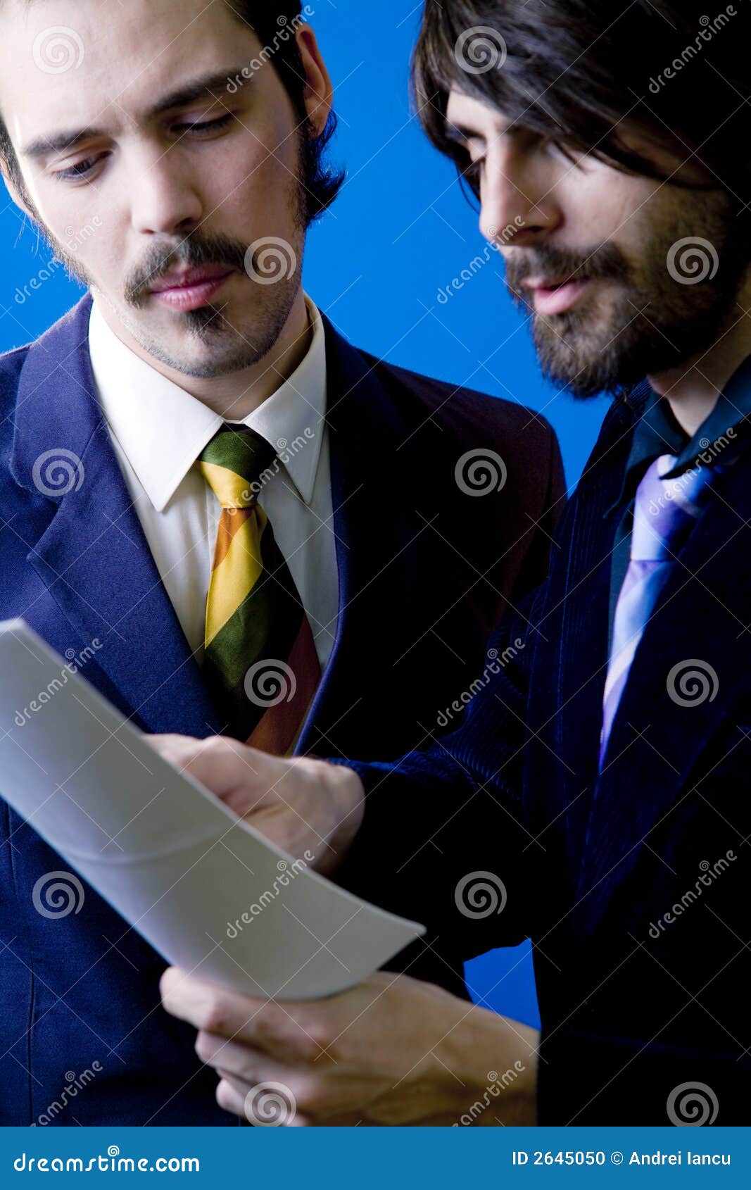 Businessmen Looking at Papers Stock Photo - Image of male, suit: 2645050