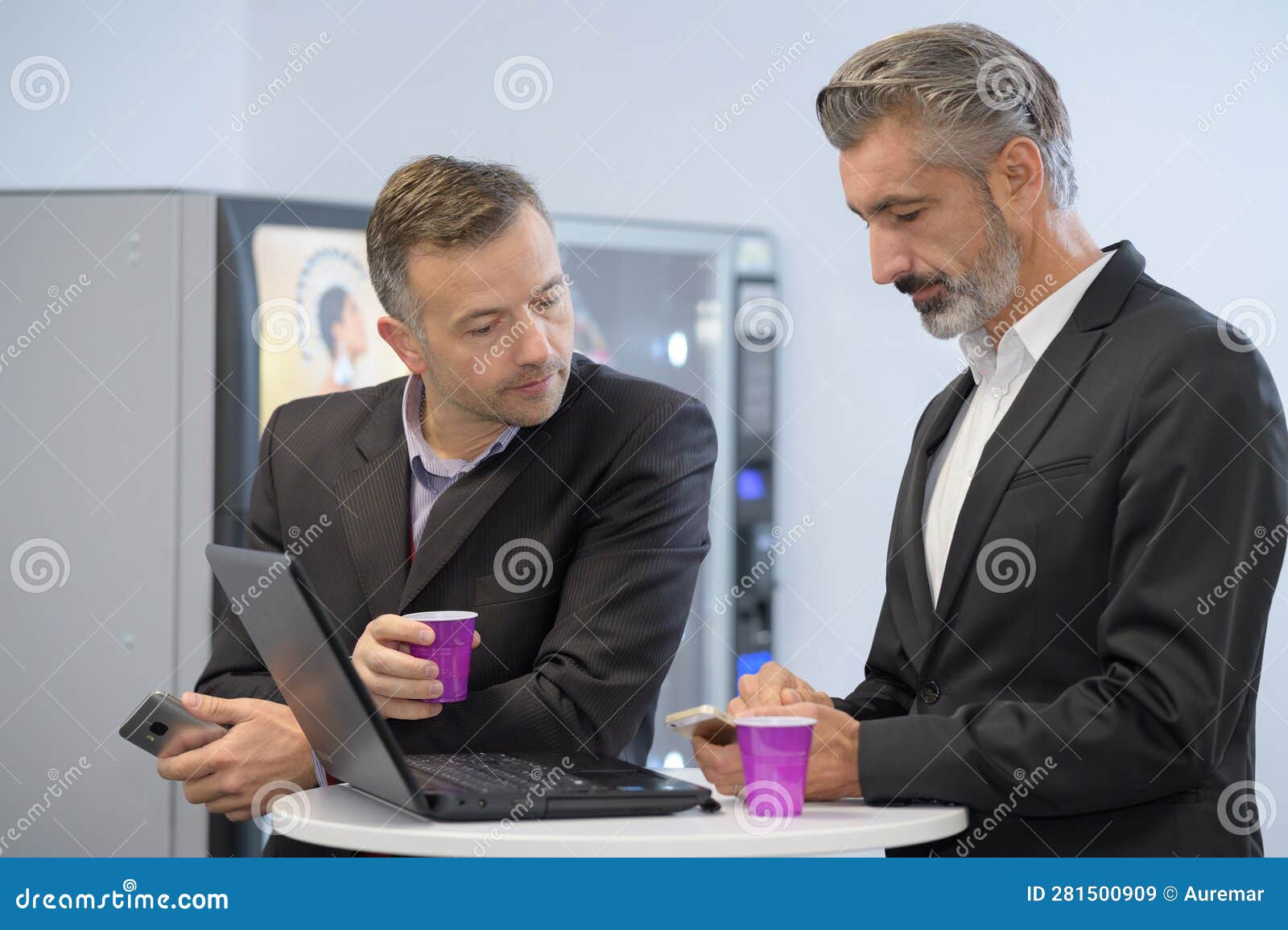 Businessmen Meeting Up in Vending Machine Coffee Pause Stock Image ...