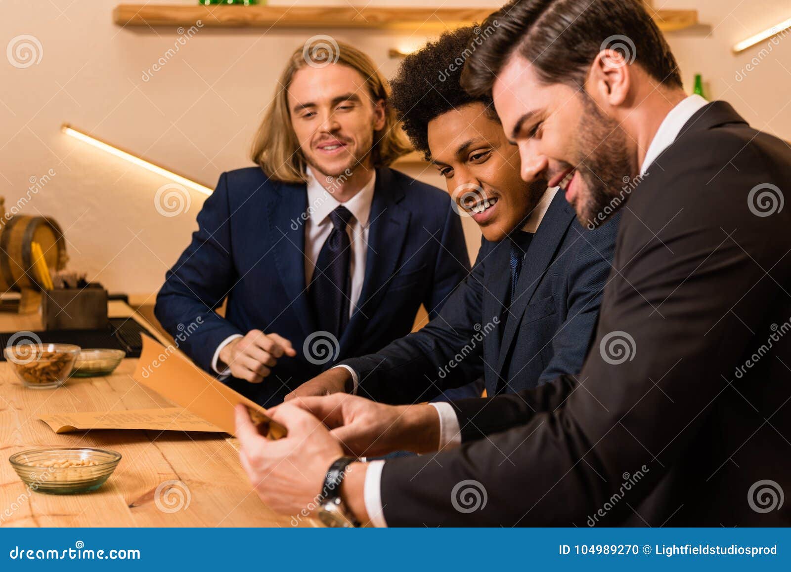Businessmen with Menu in Bar Stock Photo - Image of hold, togetherness ...