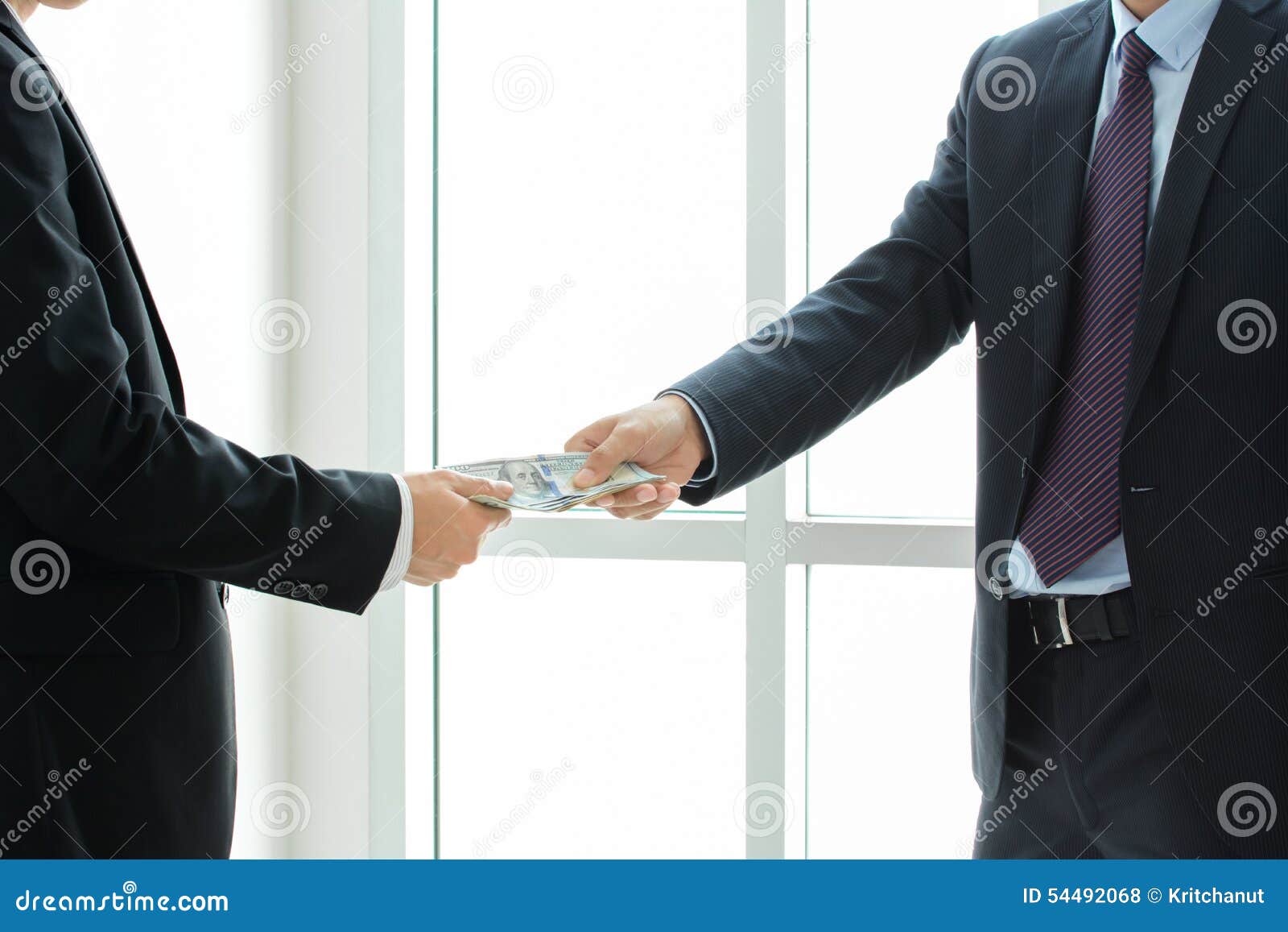 Businessmen passing money stock photo. Image of businessman - 54492068