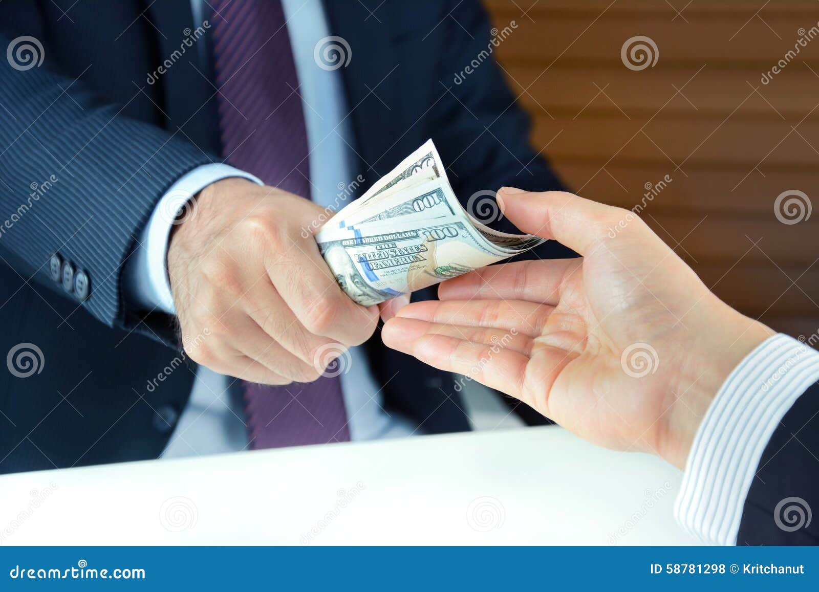 Businessmen passing money stock photo. Image of commerce - 58781298