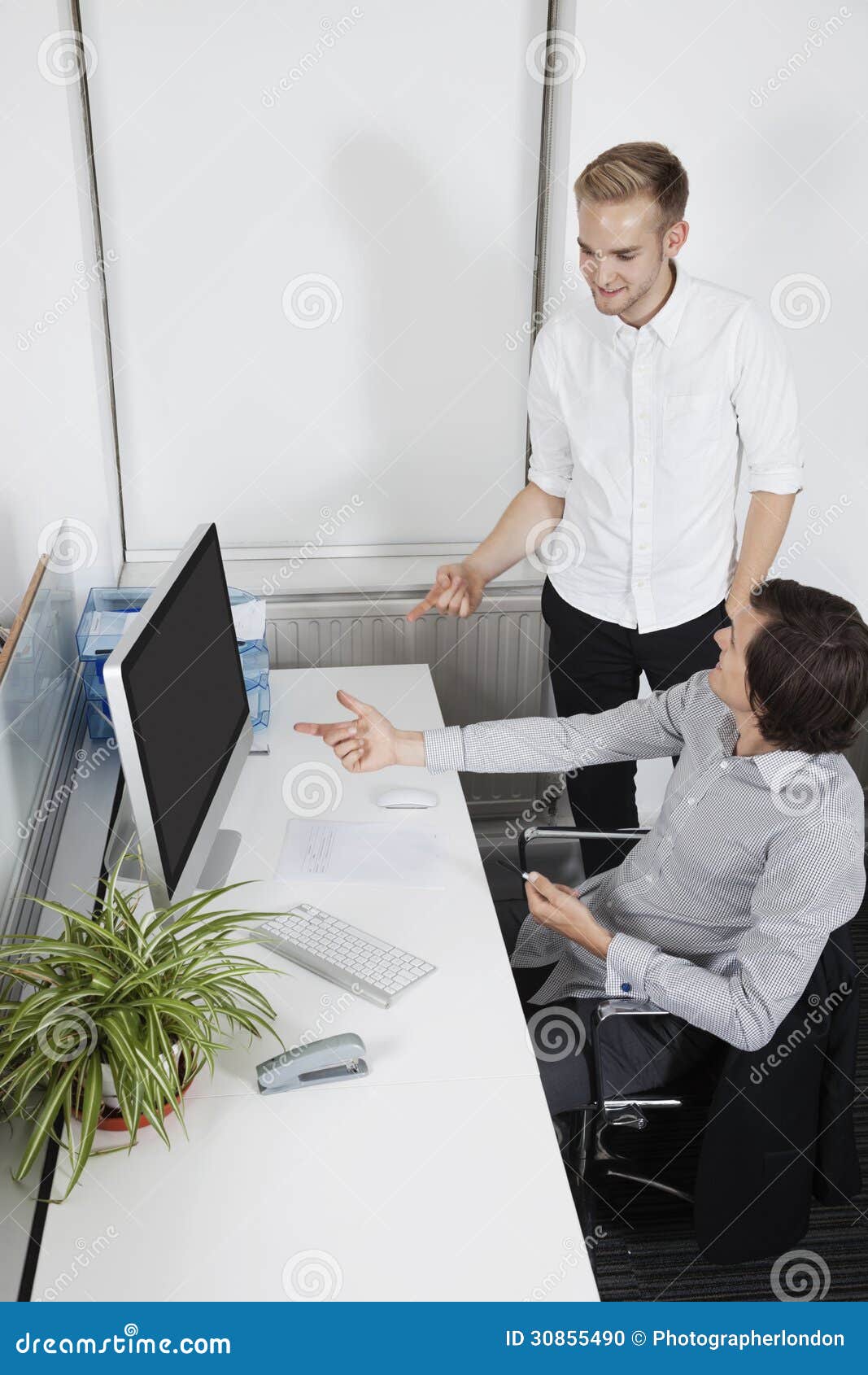 Businessmen Pointing at Computer Screen in Office Stock Photo - Image ...