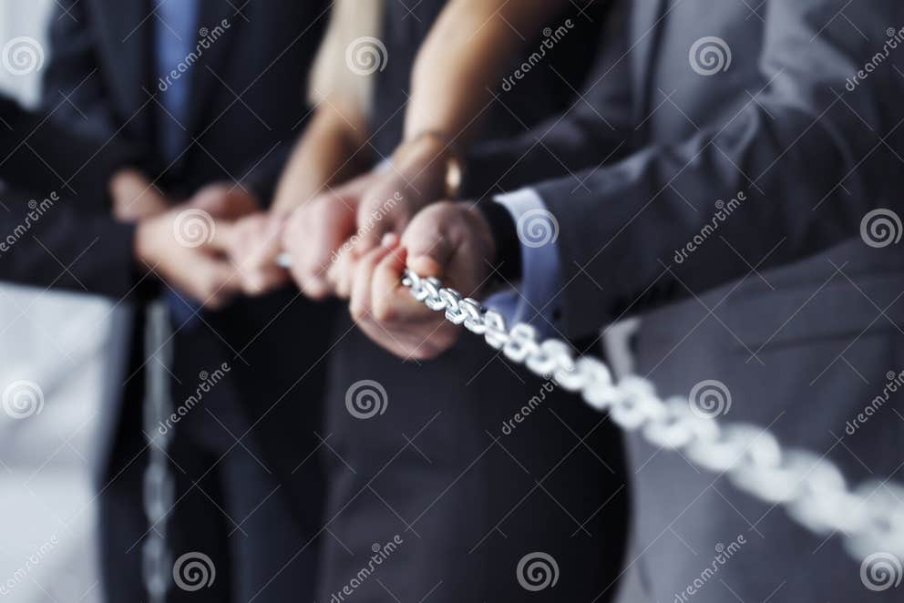 Businessmen pulling chain stock photo. Image of unity - 65569508