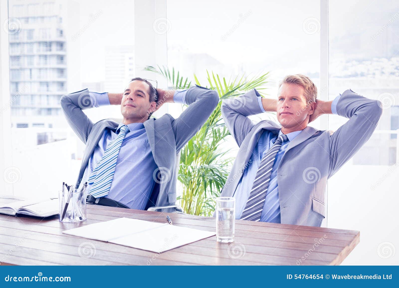 Businessmen Relaxing at Work Stock Photo - Image of chair, people: 54764654