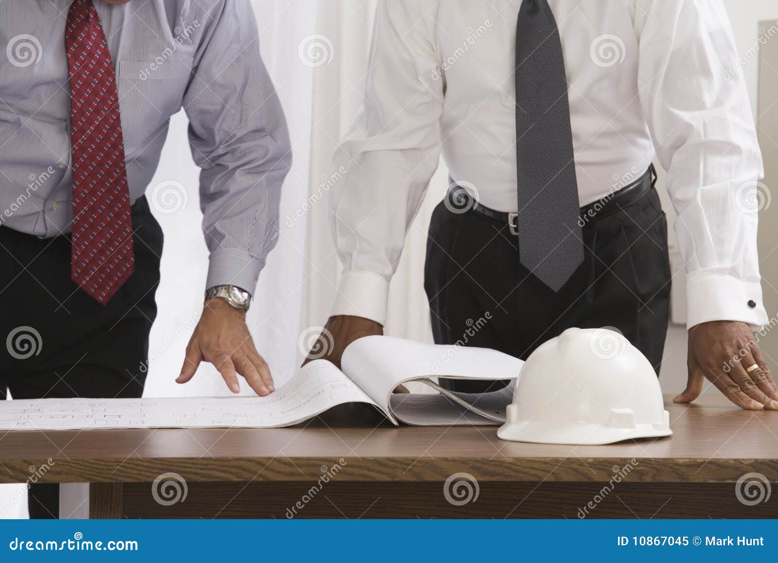Businessmen Reviewing Blueprints Stock Image - Image of dressed ... Businessmen Reviewing Blueprints Stock Image - Image of dressed ...