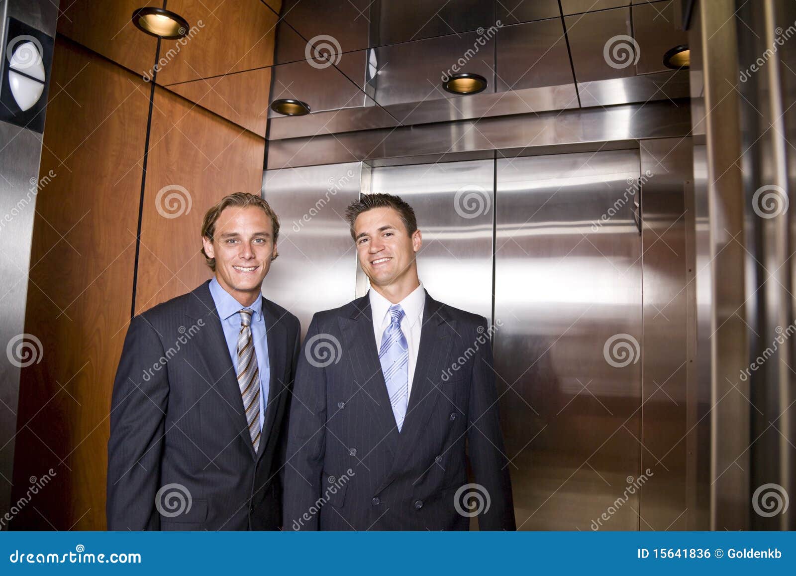 Businessmen Riding in Elevator Stock Photo - Image of caucasian, people ...