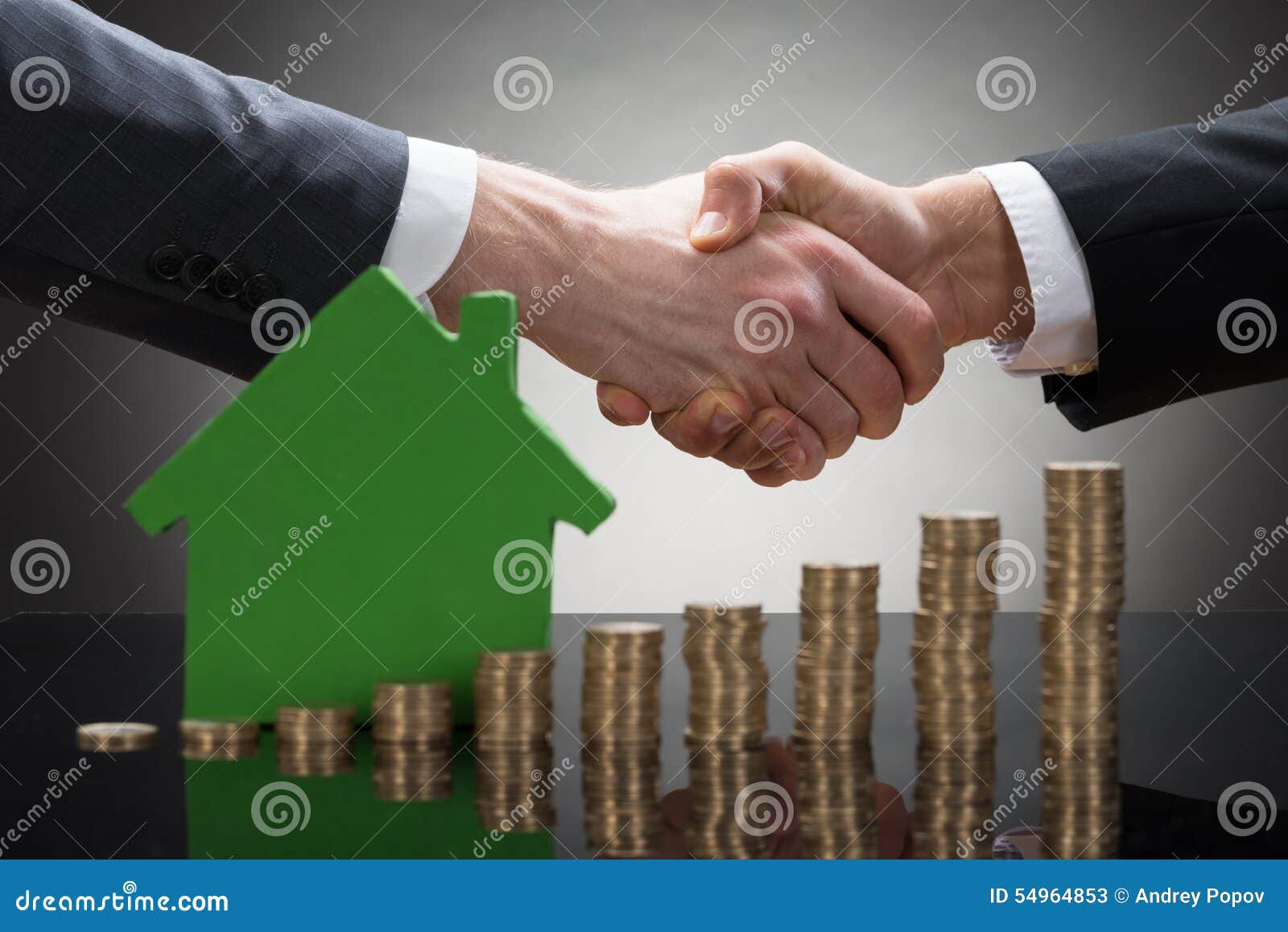 Businessmen Shaking Hands with Coins and House Model Stock Image ...
