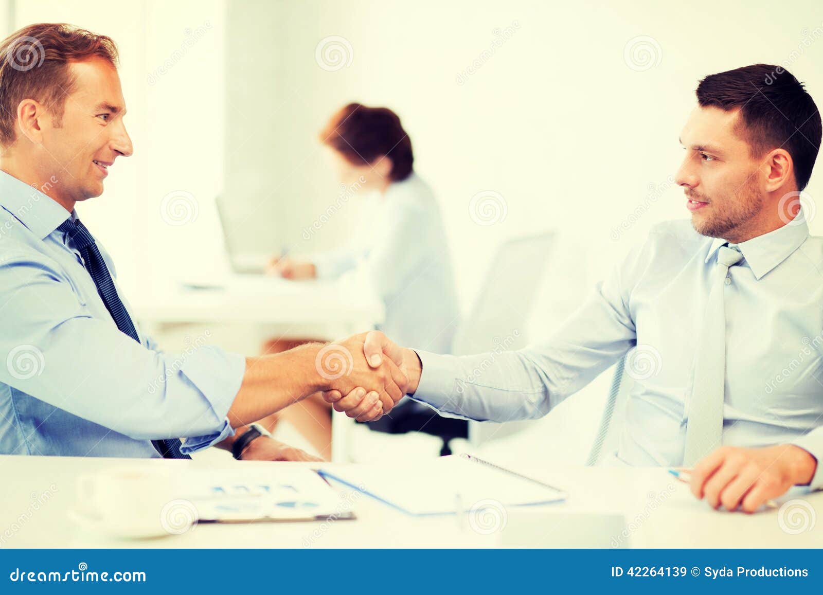 Businessmen Shaking Hands in Office Stock Image - Image of businessmen ...