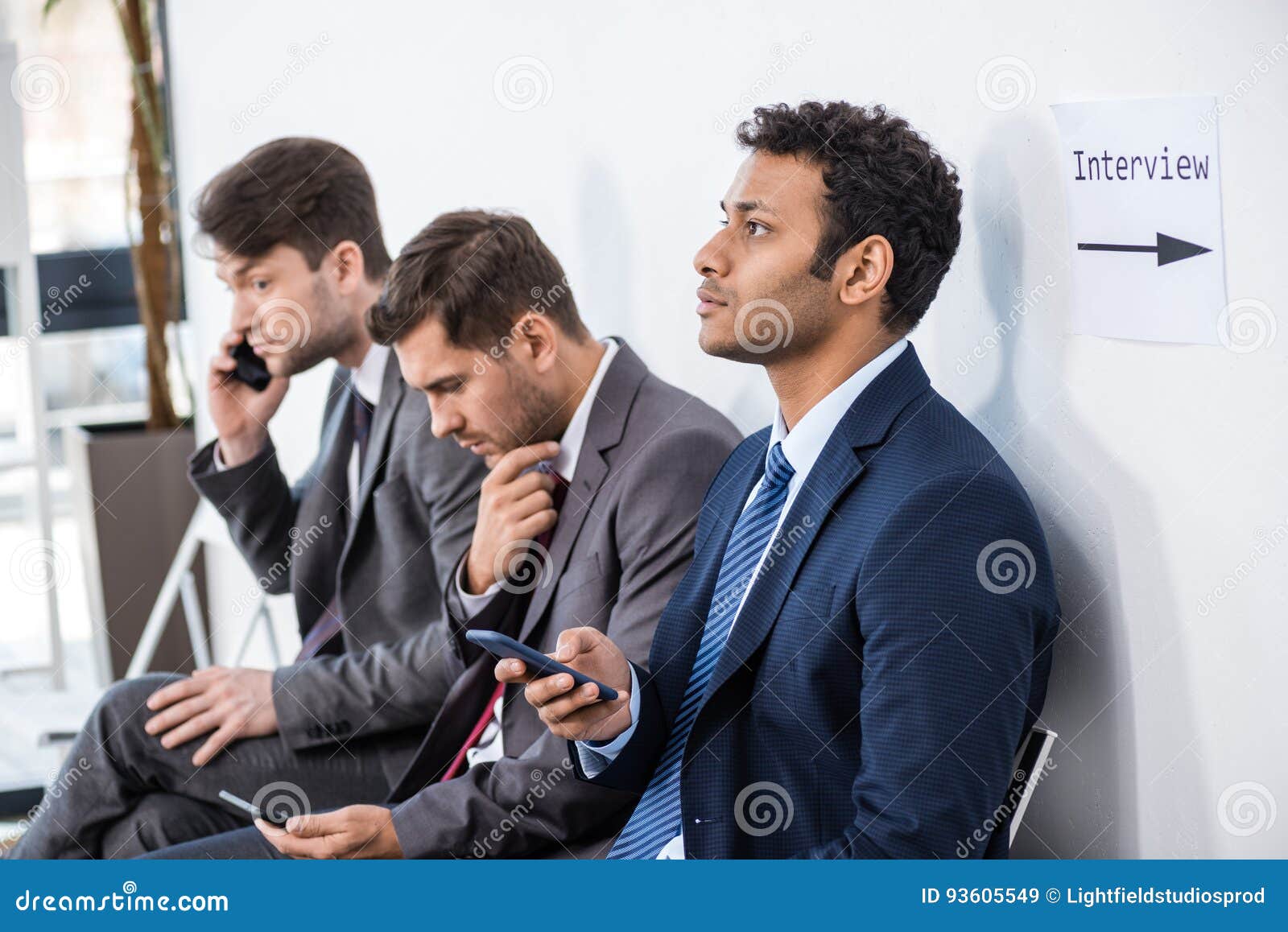Businessmen Sitting in Queue and Waiting for Interview in Office Stock ...