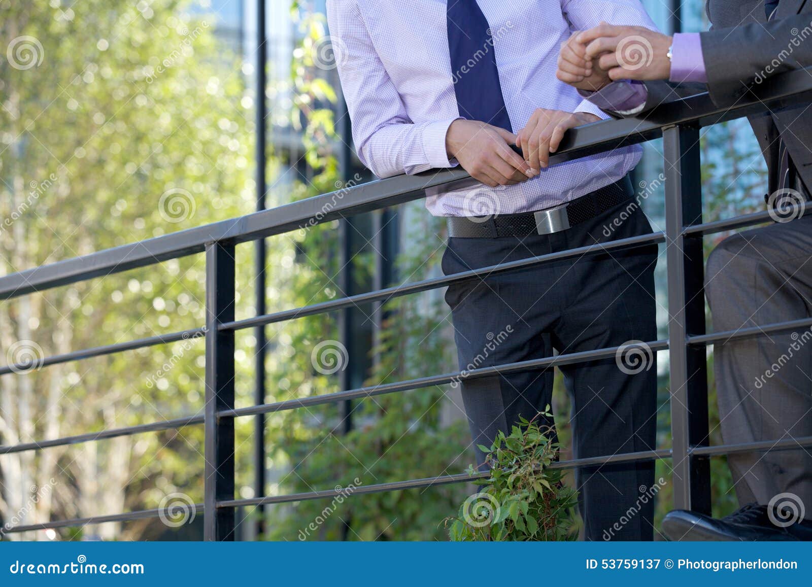 Businessmen Standing by Railing Stock Image - Image of metal ...