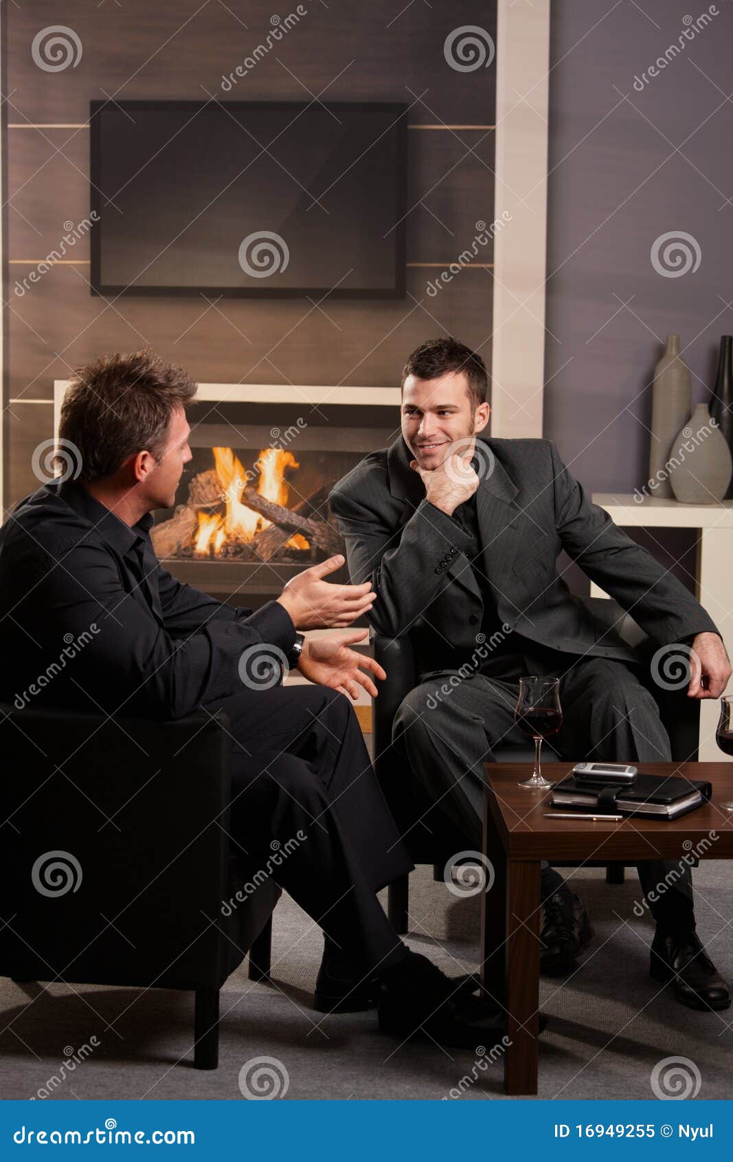 Businessmen talking in bar stock image. Image of drinks - 16949255