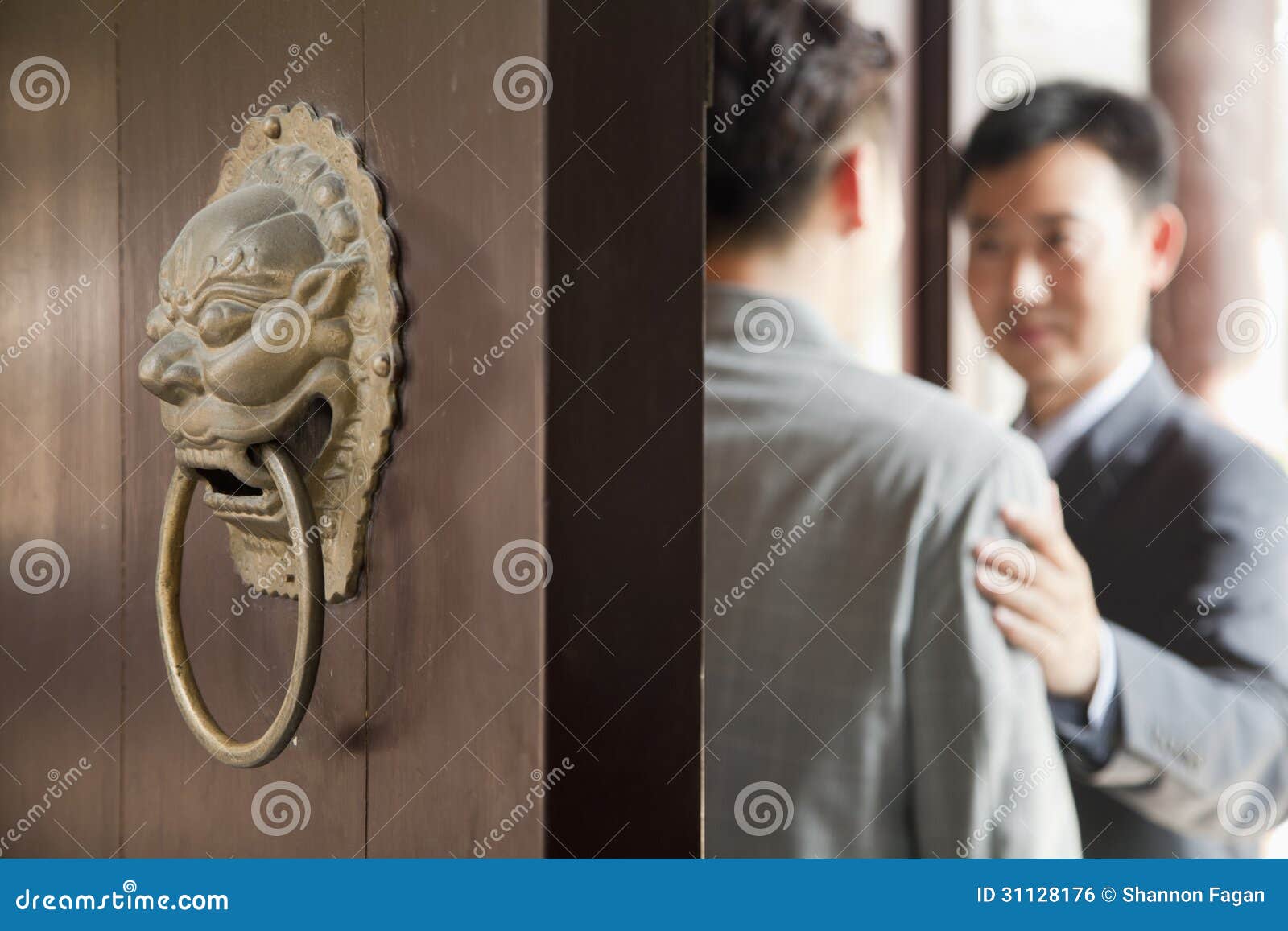 Businessmen Talking Behind Open Door Stock Photo - Image of metal ...