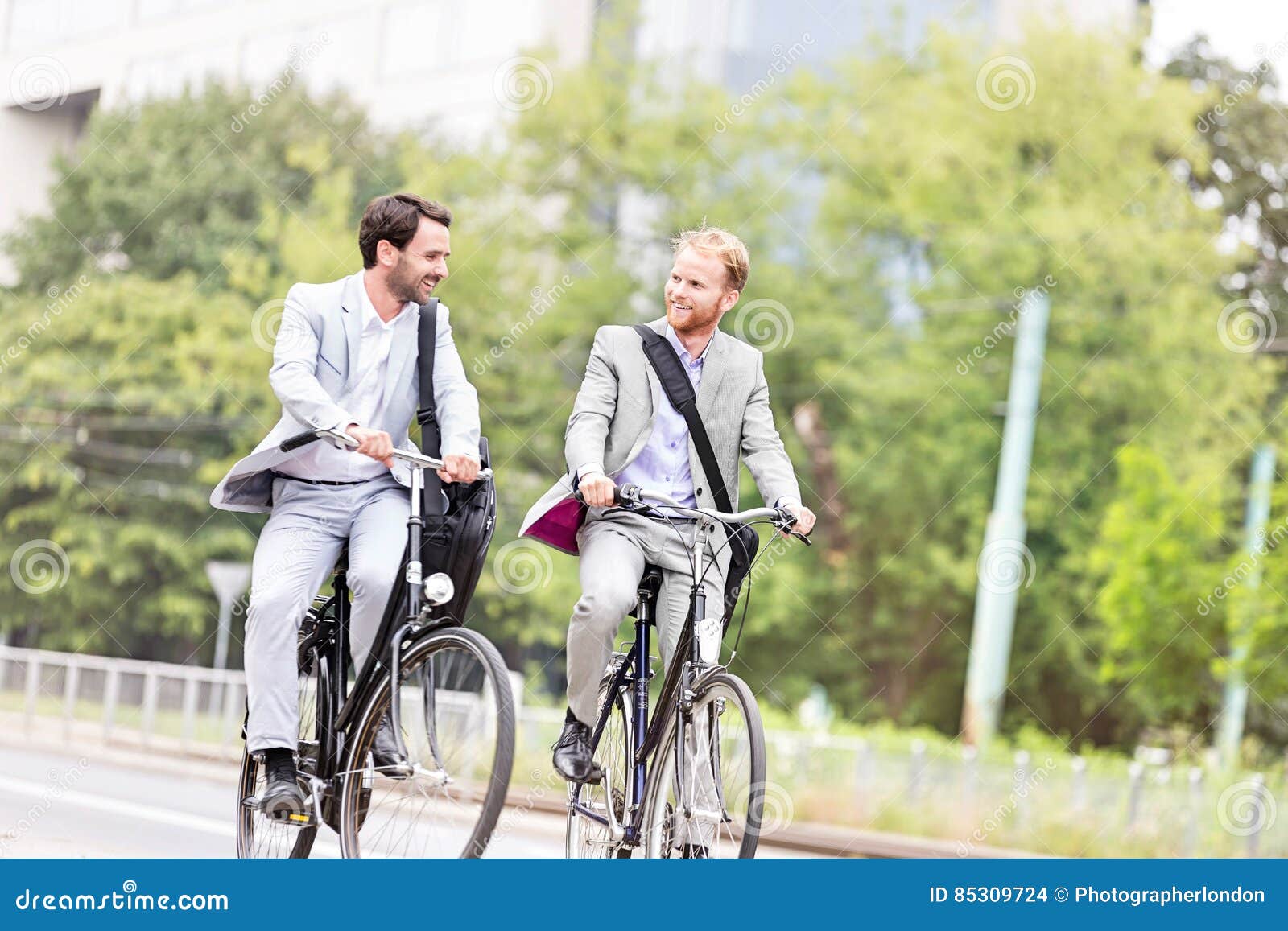 Businessmen Talking while Cycling Outdoors Stock Photo - Image of ...