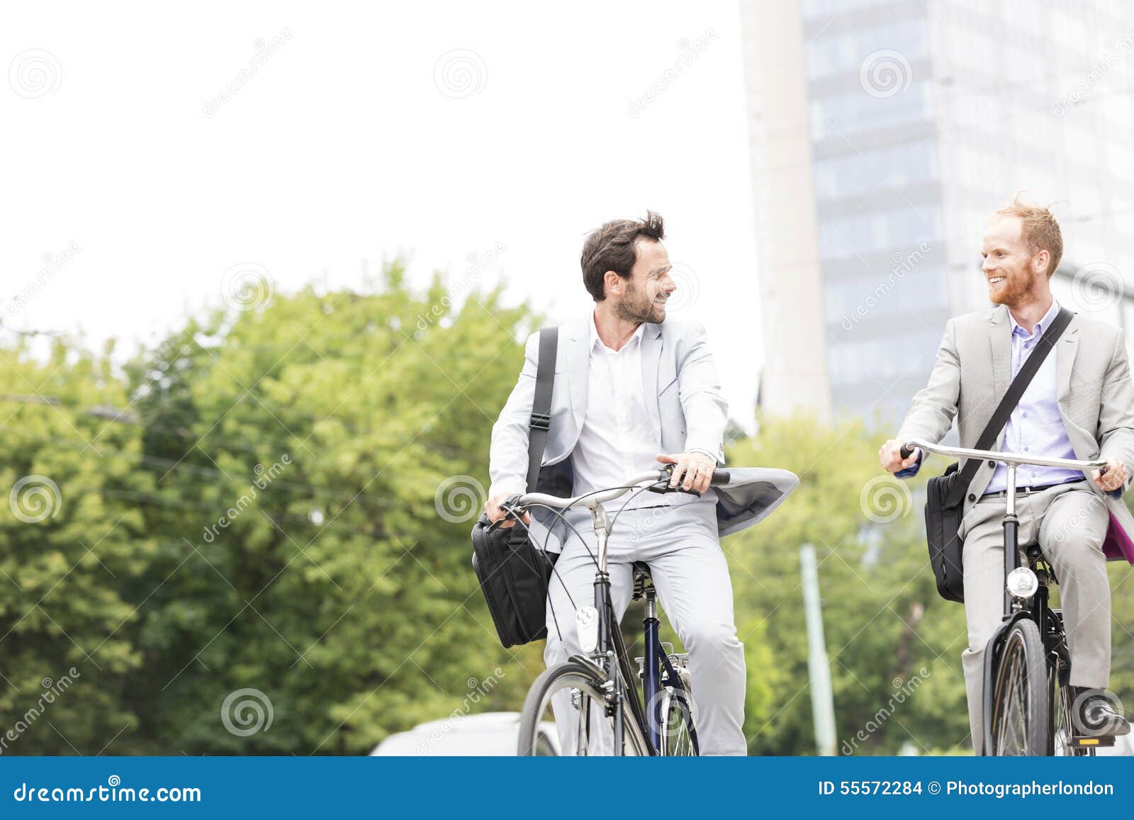Businessmen Talking while Riding Bicycles Outdoors Stock Photo - Image ...