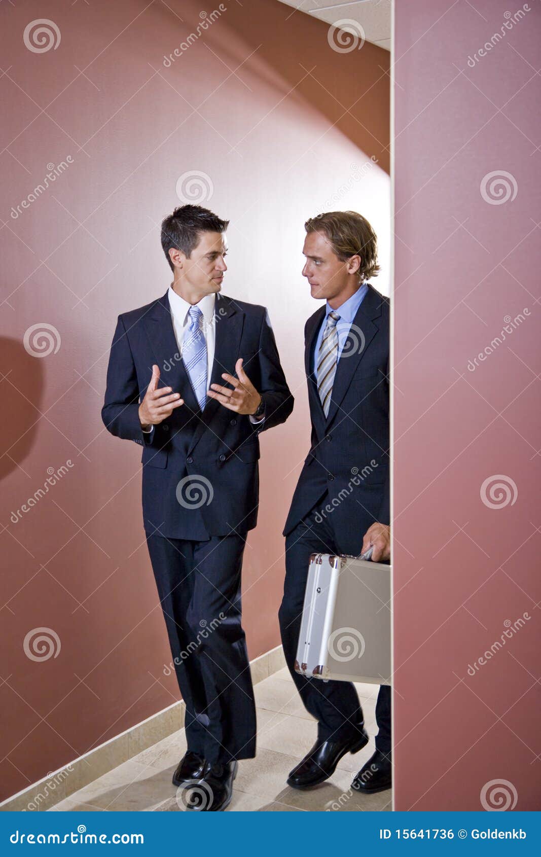 Businessmen Talking, Walking in Office Corridor Stock Photo - Image of ...