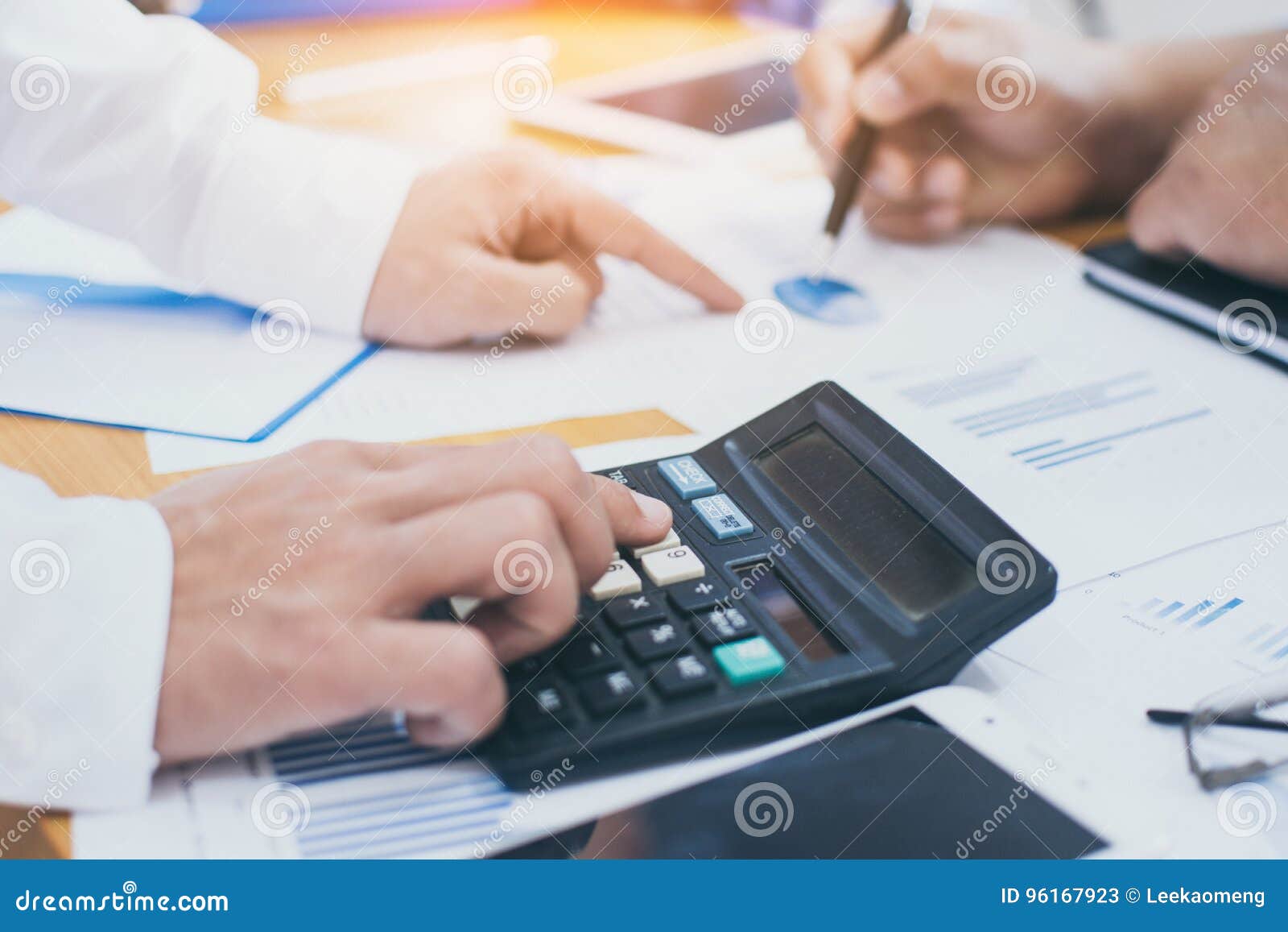 Businessmen Use the Calculator To Calculate and Analysis. Stock Image ...