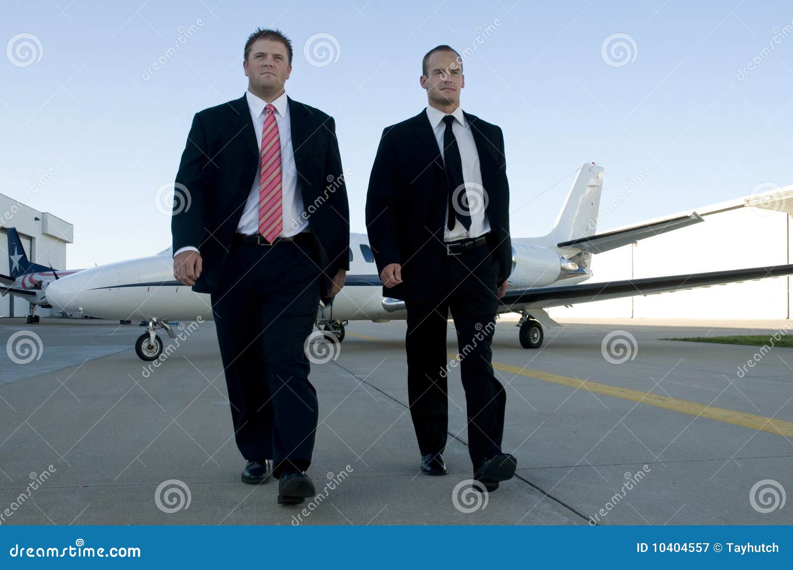 Businessmen Walking Away from Corporate Jet Stock Image - Image of ...