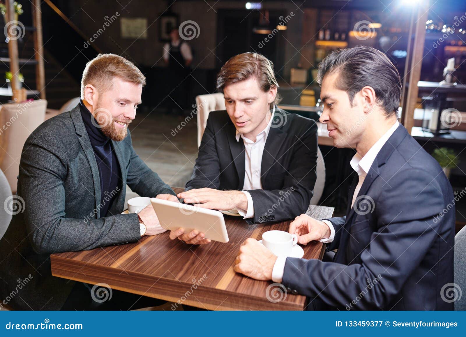 Businessmen Watching Presentation at Coffee Break Stock Image - Image ...