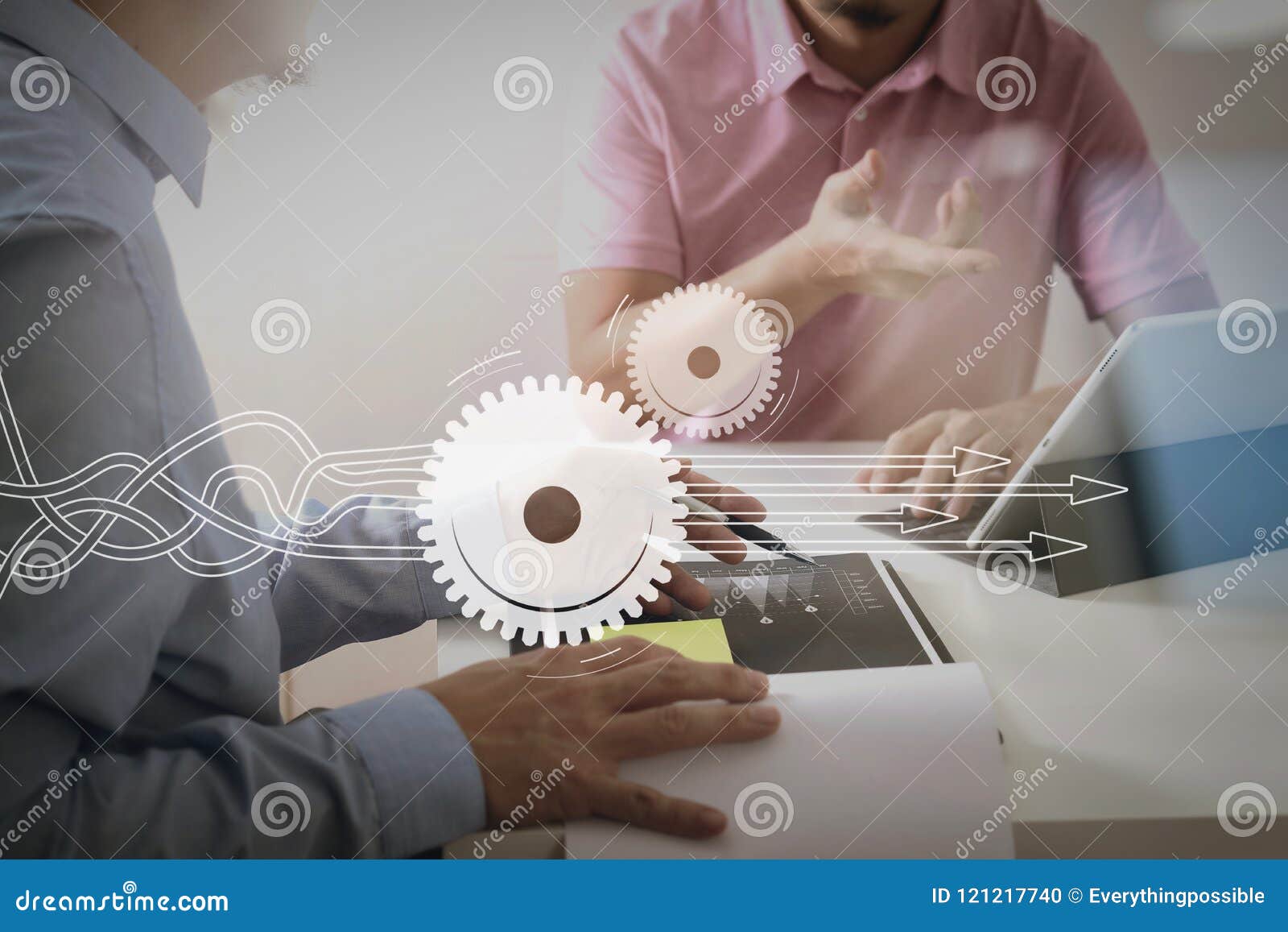 Businessmen Working Together on a Document and Using Smart Phone Stock ...