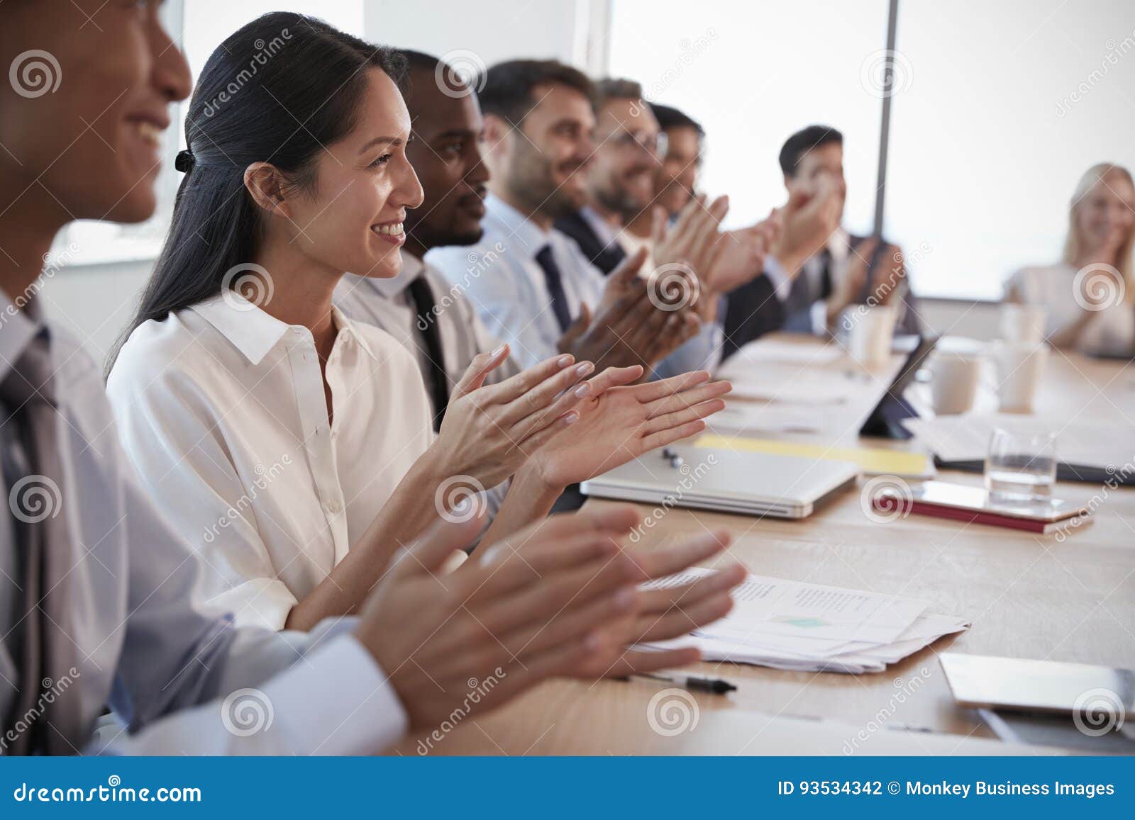 Businesspeople Around Boardroom Table Applaud Presentation Stock Photo ...