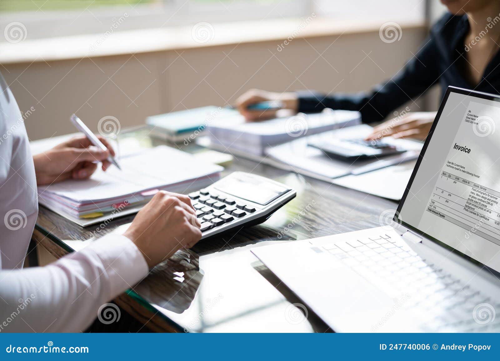 Businesspeople Calculating Invoice with Calculator Stock Photo - Image ...
