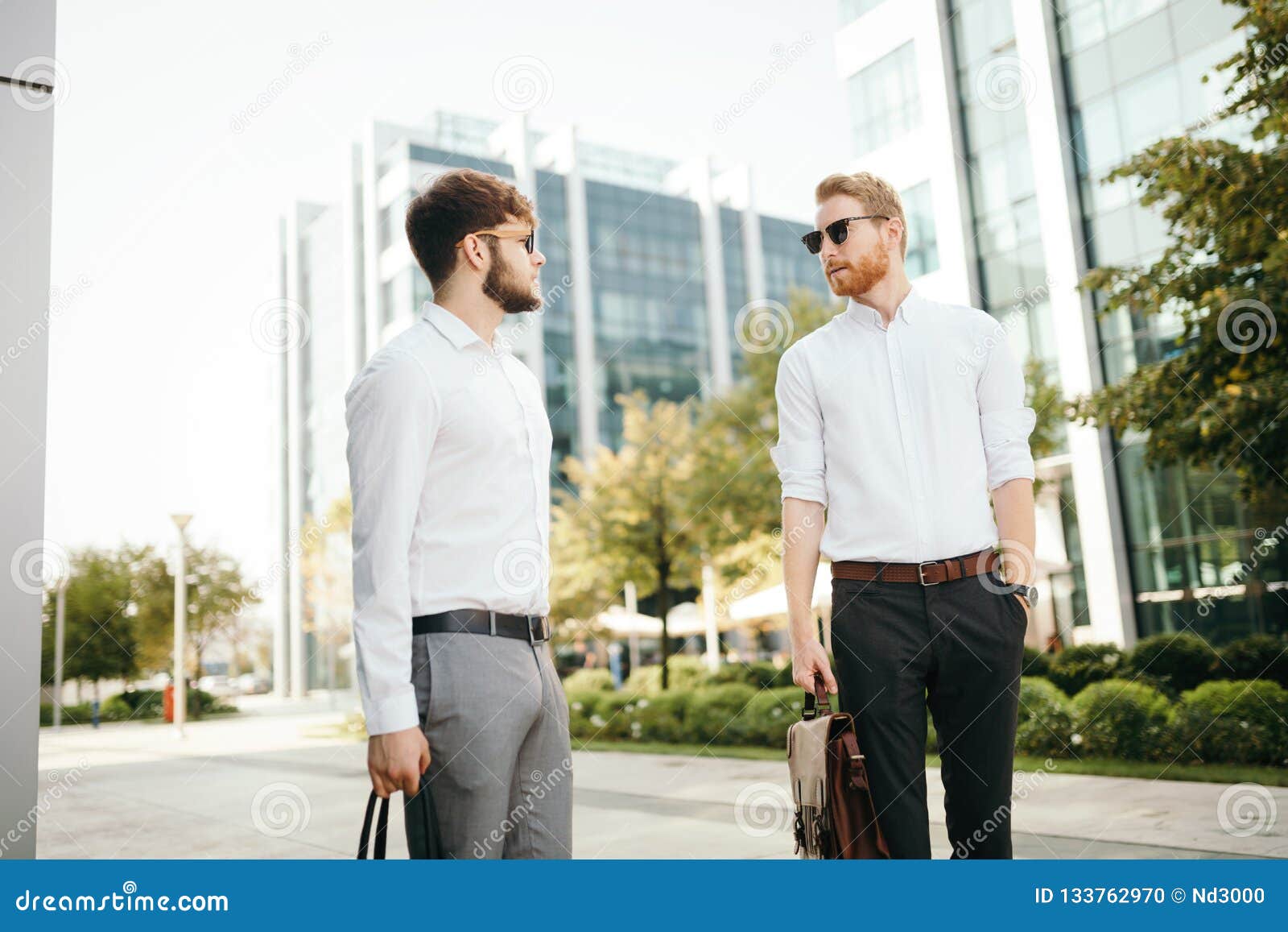 Businesspeople Chatting Outdoors Stock Photo - Image of colleagues ...