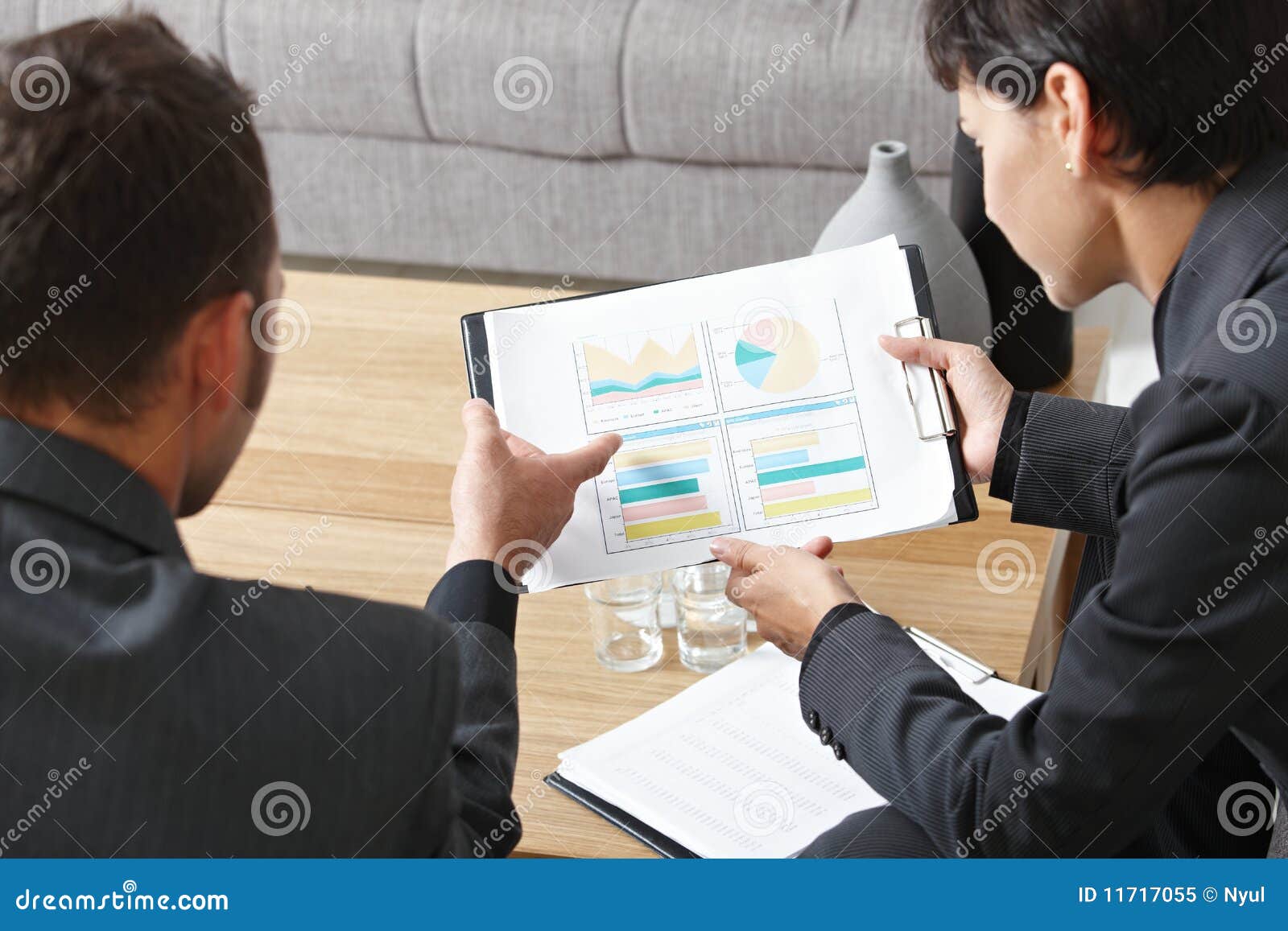 Businesspeople Discussing Charts Stock Image - Image of brainstorming ...