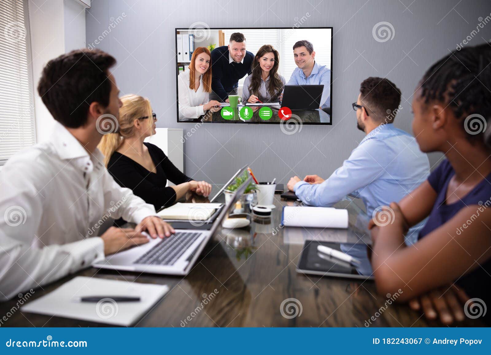 Businesspeople Discussing Graphs through Videochat Stock Image - Image ...