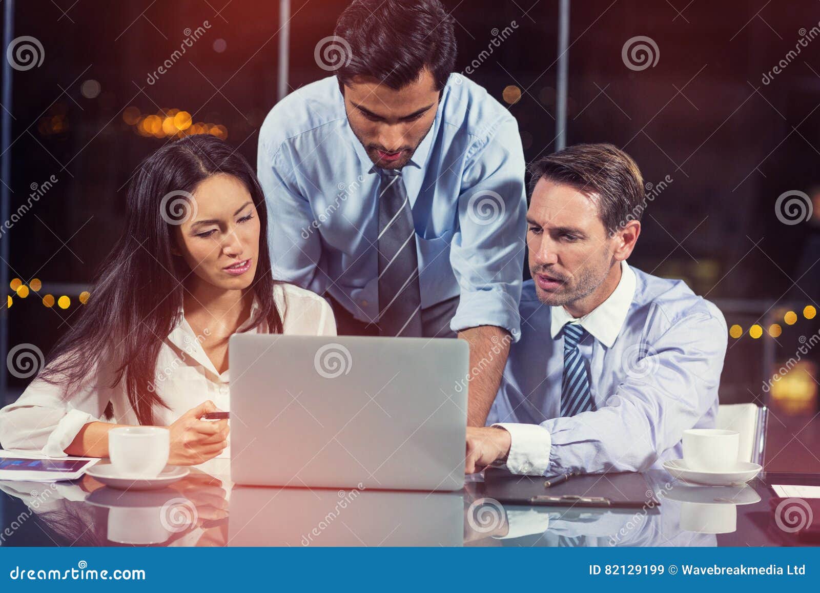 Businesspeople Discussing Over Laptop Stock Image - Image of female ...