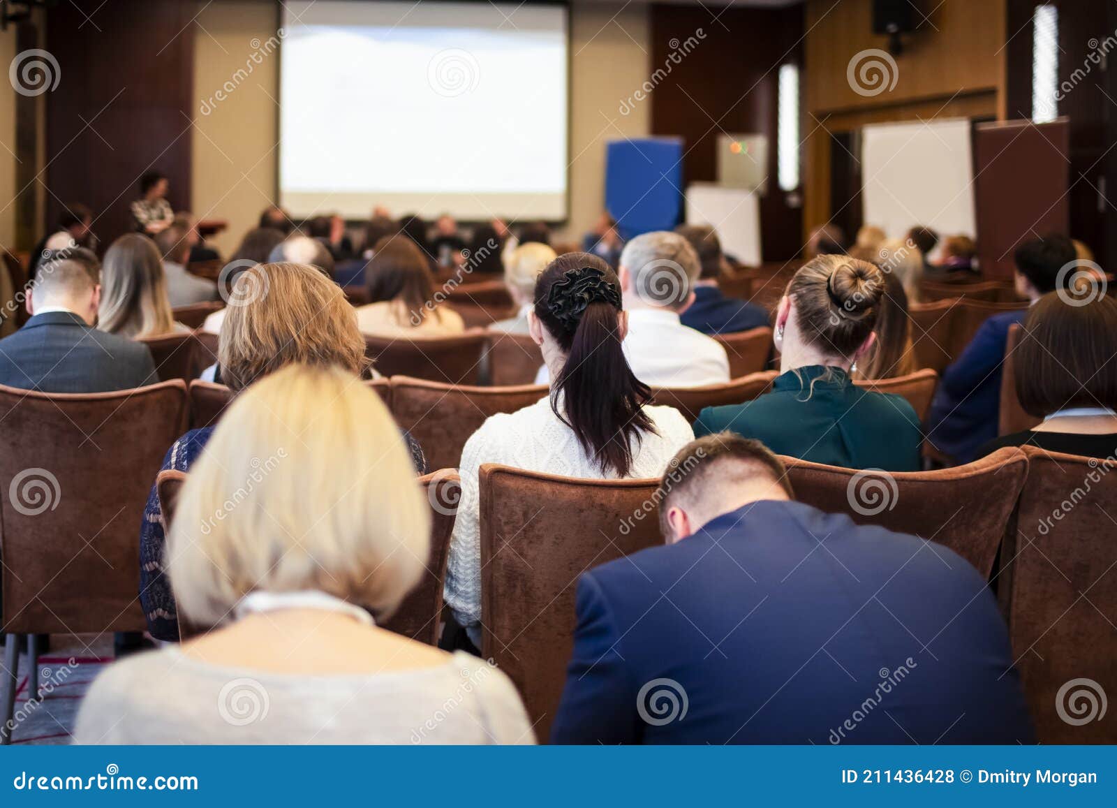 Businesspeople during Discussion Panel. Female Host Speaking in Front ...