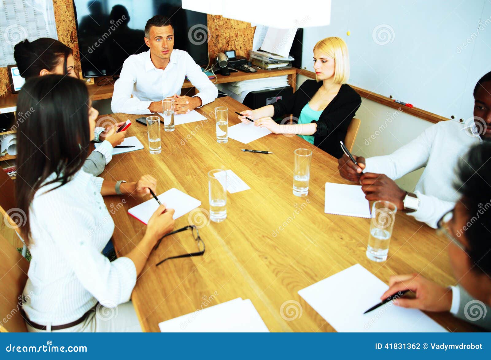 Businesspeople Having Meeting Around Table Stock Photo - Image of ...