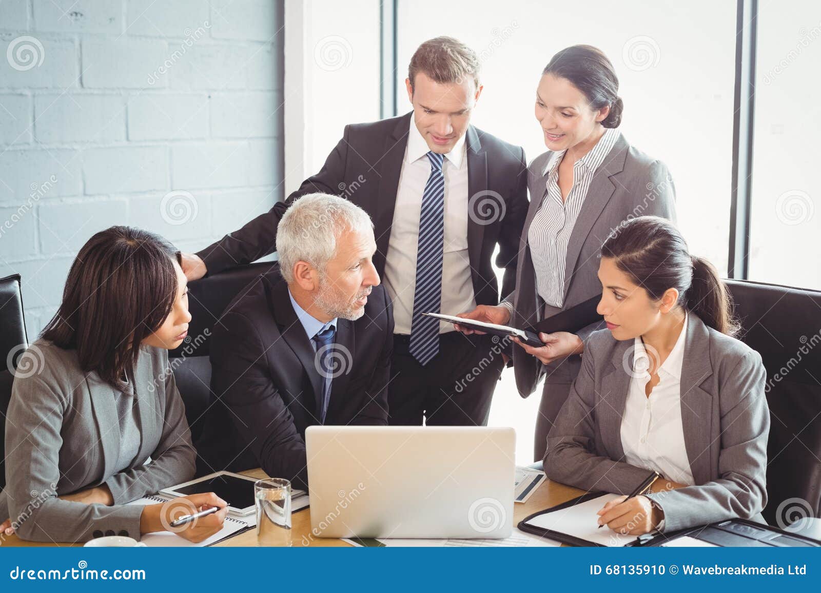 Businesspeople Interacting in Conference Room Stock Photo - Image of ...