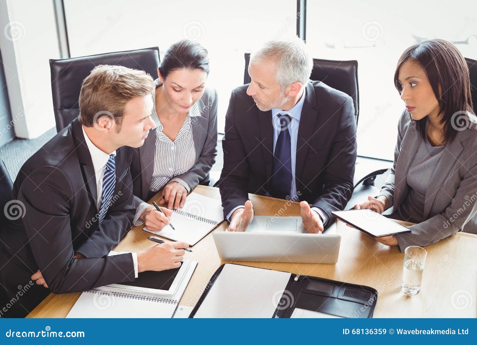 Businesspeople Interacting in Conference Room Stock Image - Image of ...